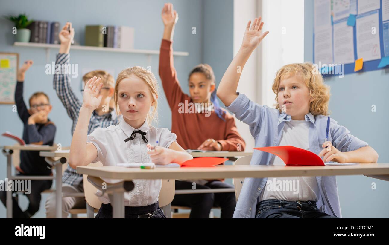 Elementary Classroom of Diverse Children Listening to the Teacher ...