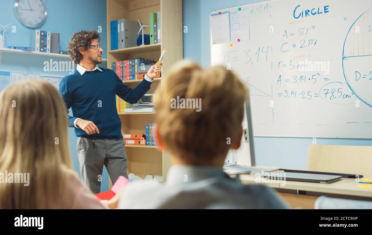 Teacher Explains Lesson to a Classroom Full of Bright Diverse Children ...