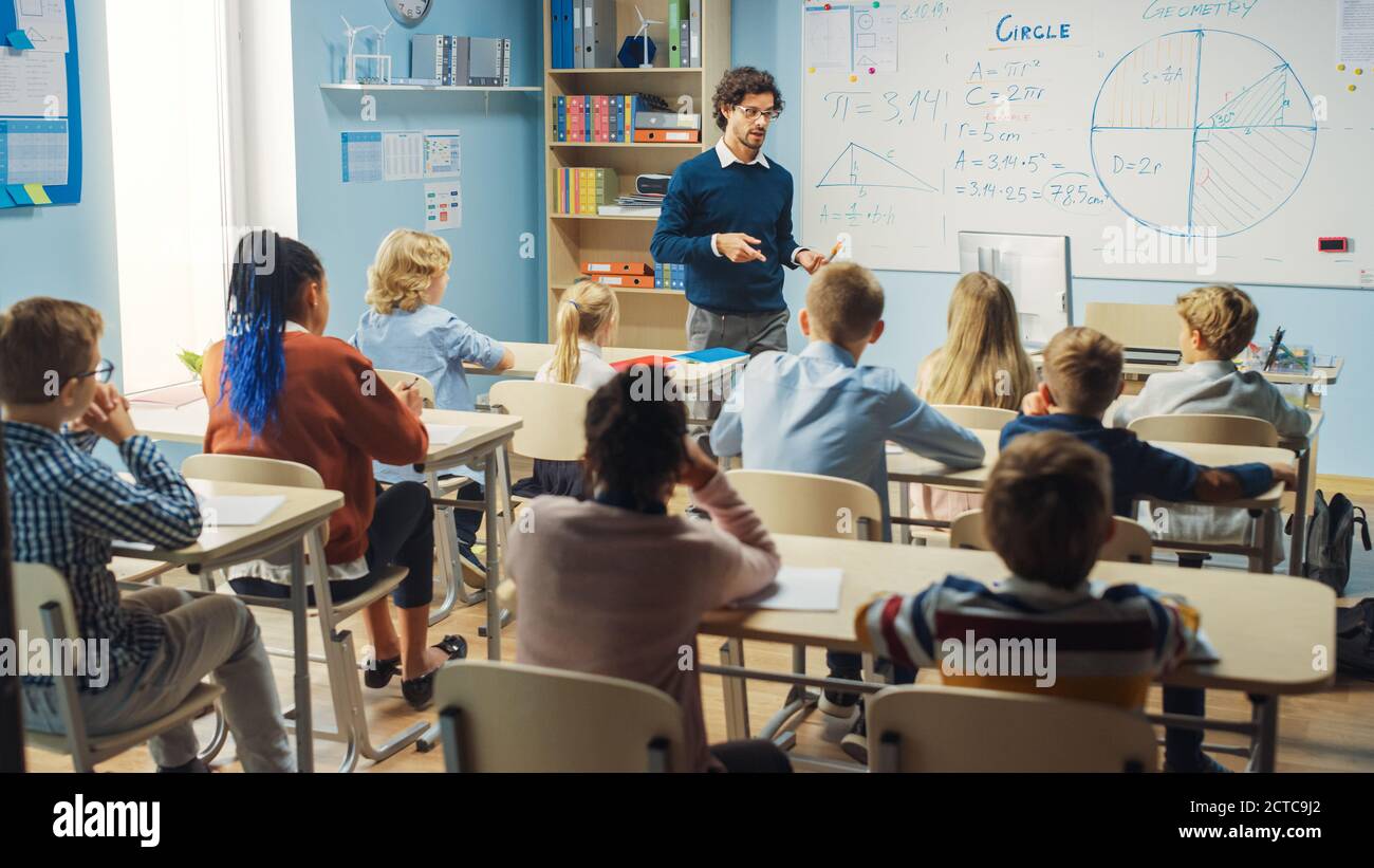 Elementary Classroom of Diverse Bright Children Listening Attentively ...