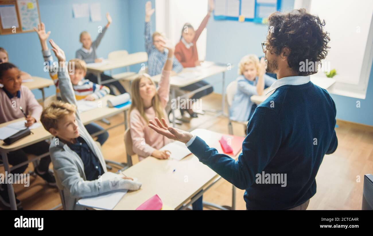 Elementary Classroom of Diverse Bright Children Listening to Teacher ...