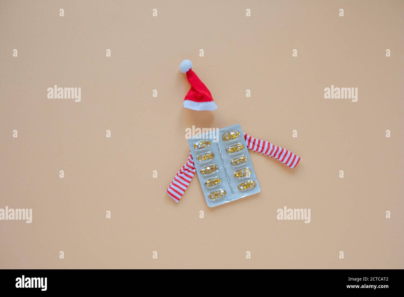Christmas composition golden glitter pills on pastel background ...