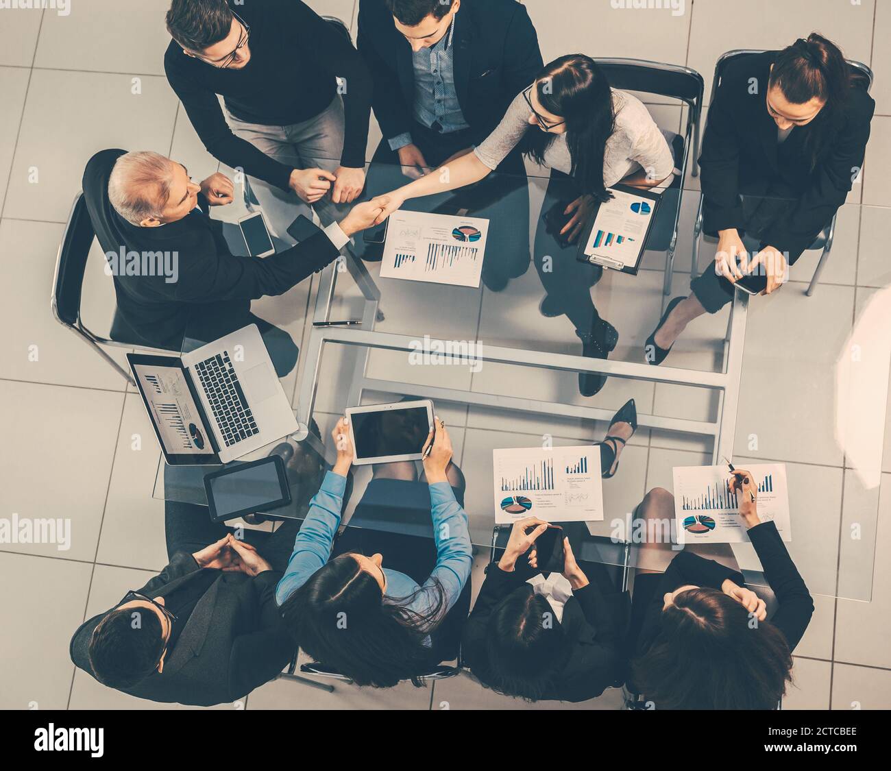 top view. handshake of financial partners at a working meeting Stock ...