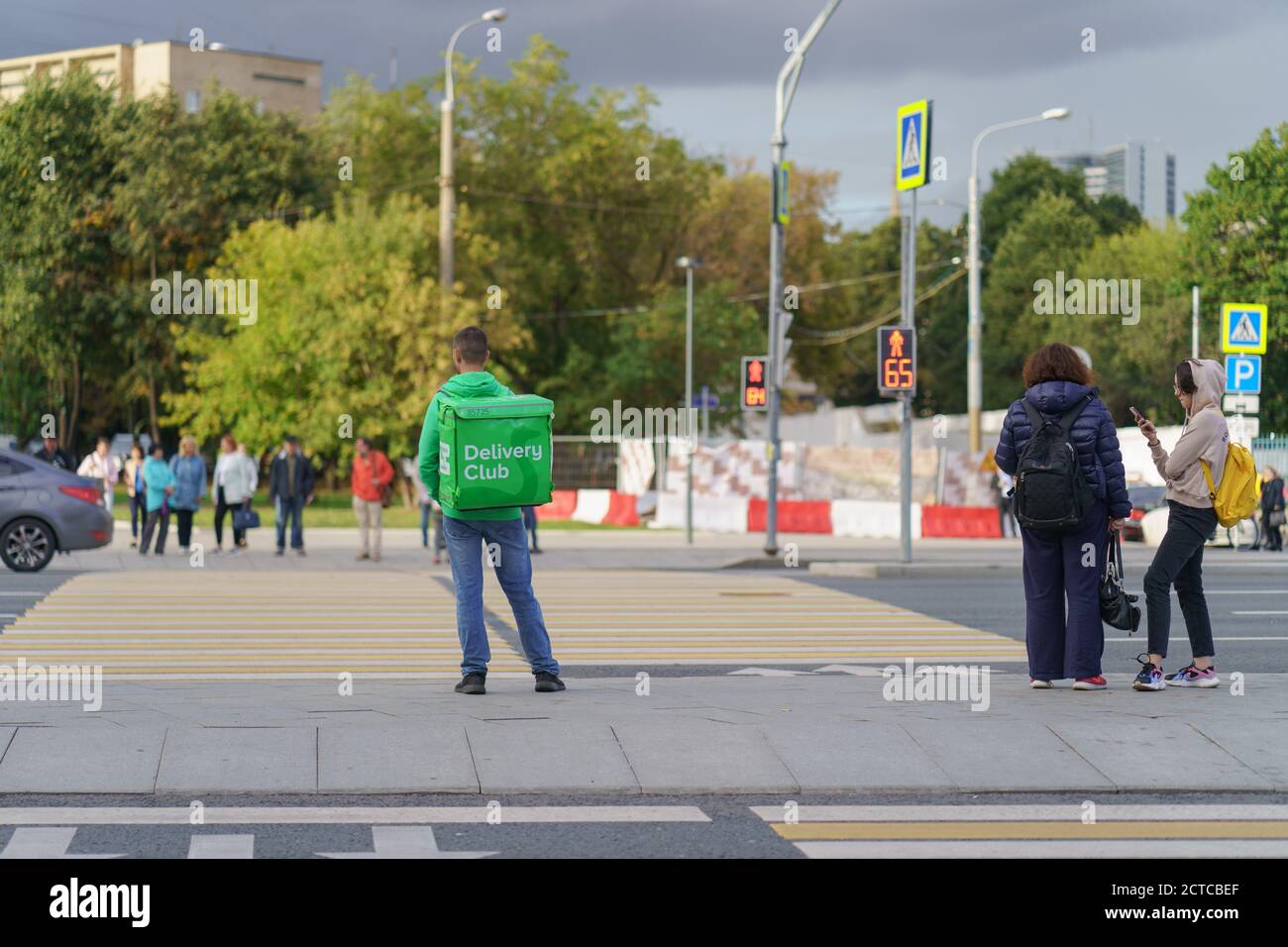 Moscow, Russia - September 9, 2020: Delivery man stopped in front of ...