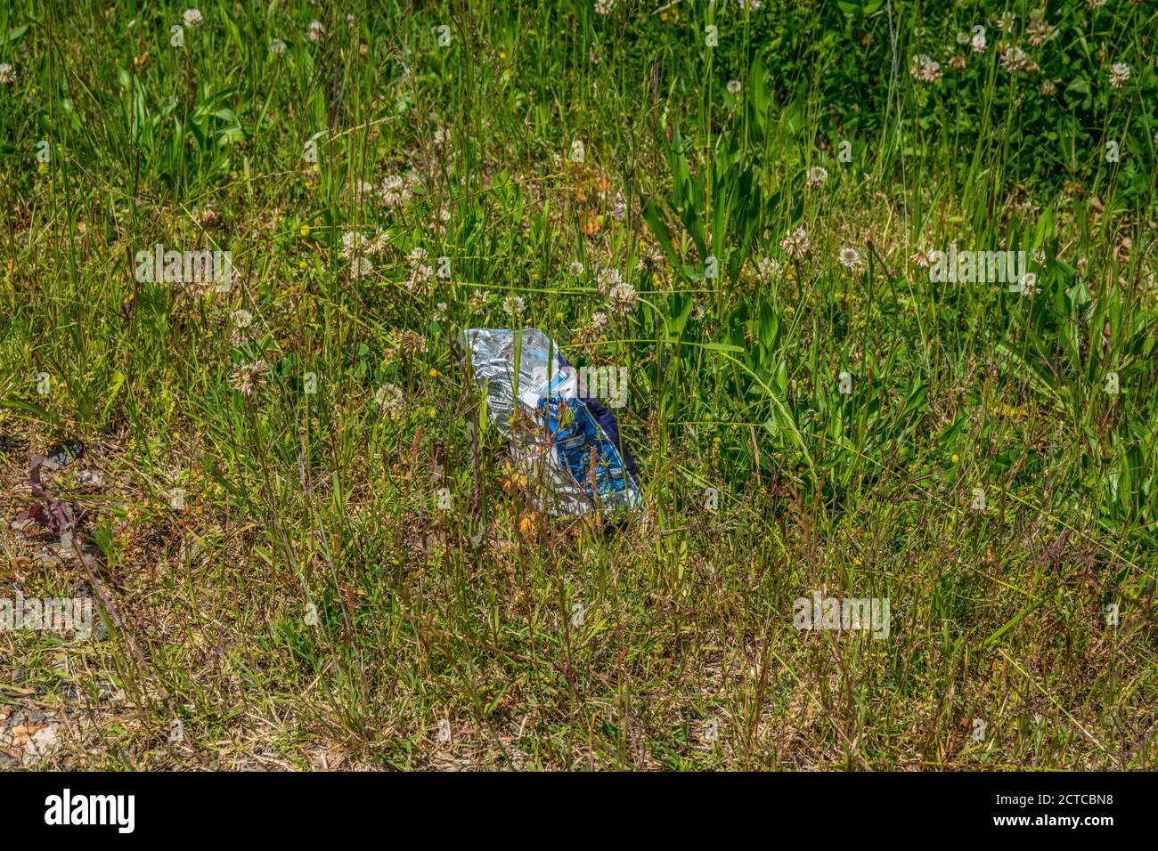 Empty chip bag trash hi-res stock photography and images - Alamy