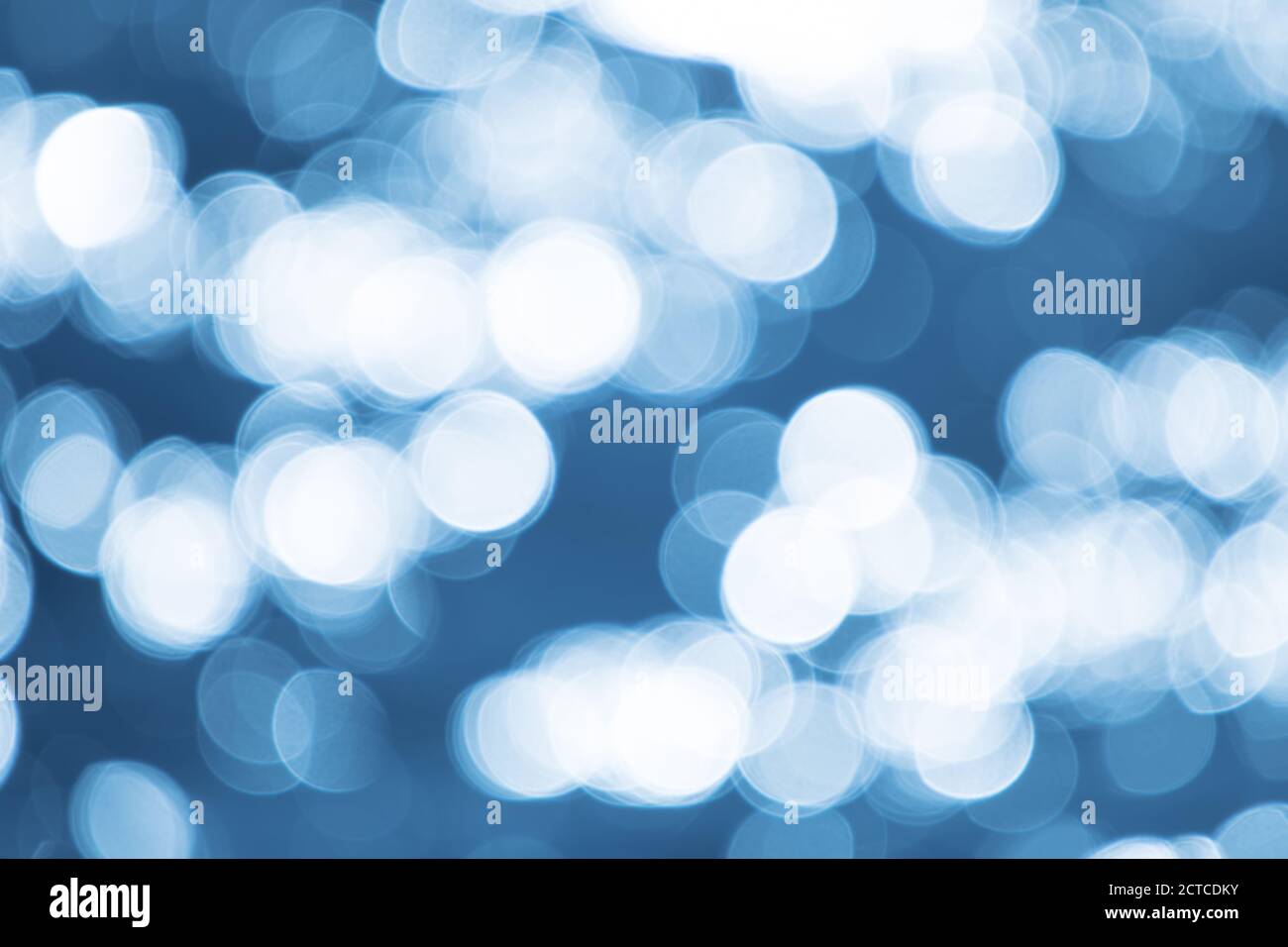 Blurry abstract background, blue defocused bokeh lights, useful as ...