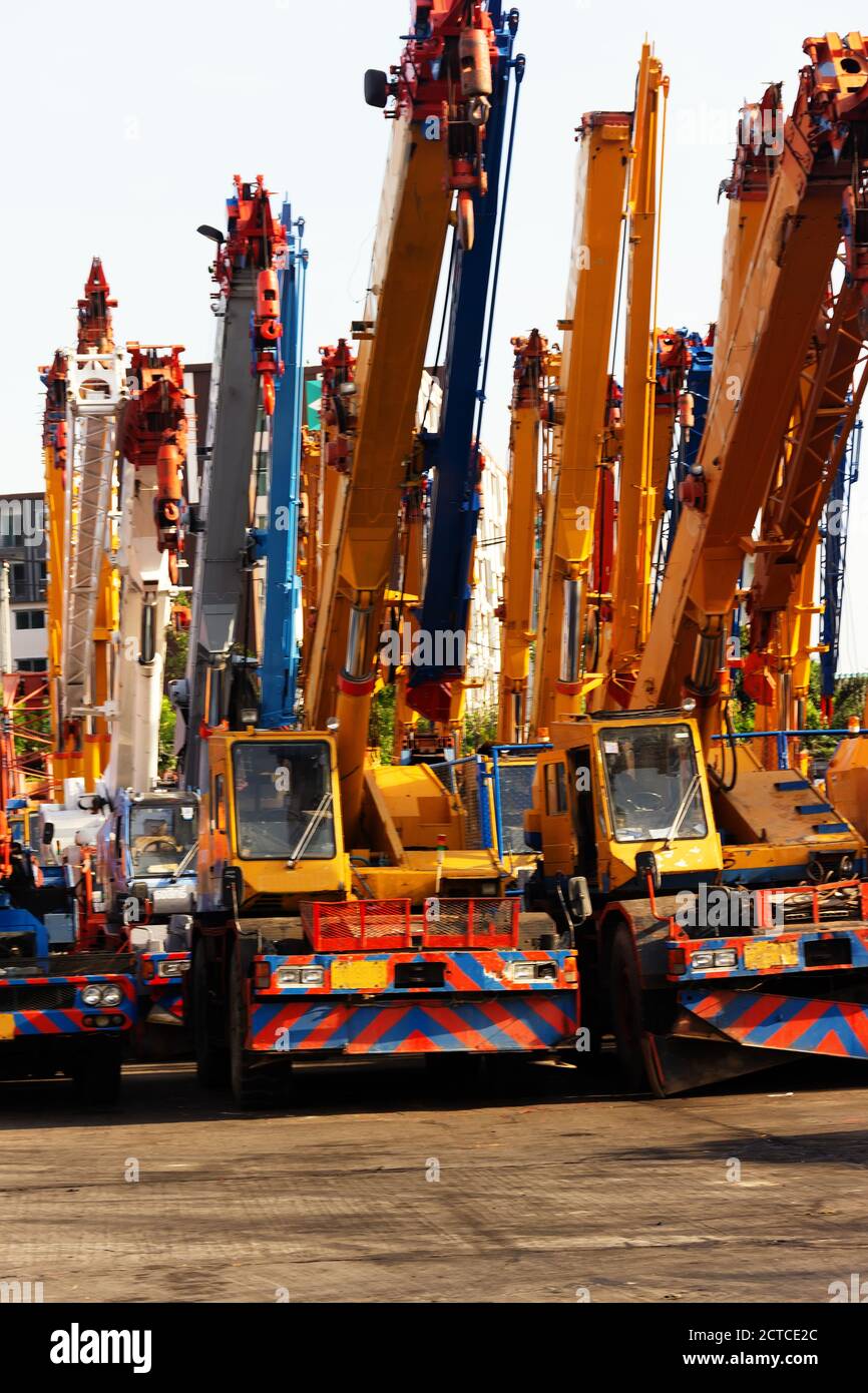 Impressive "forest" of crane arrows (gib arm of autocranes). Parade of ...