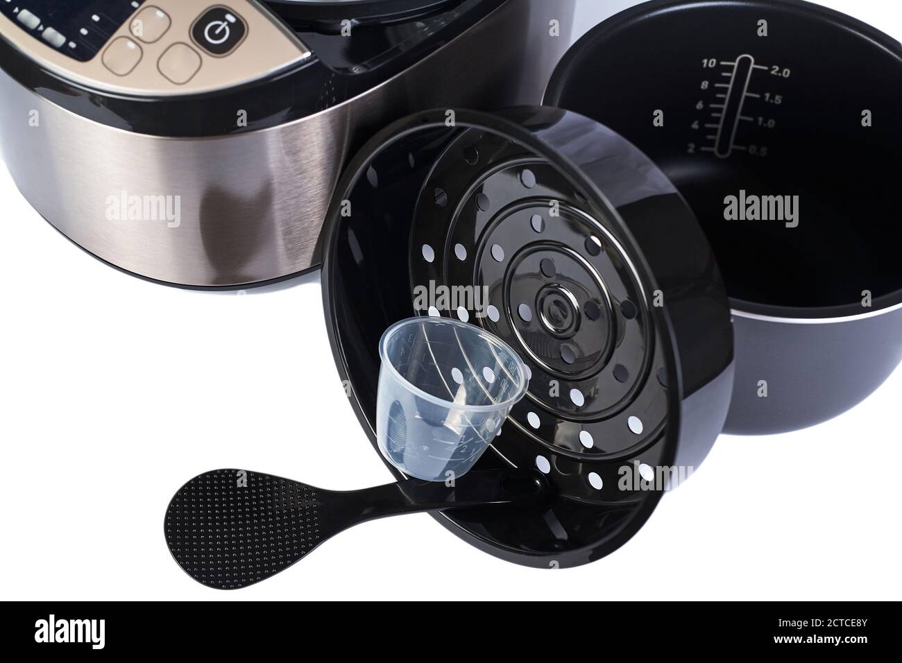 Automatic multicooker and accessories set isolated on a white ...