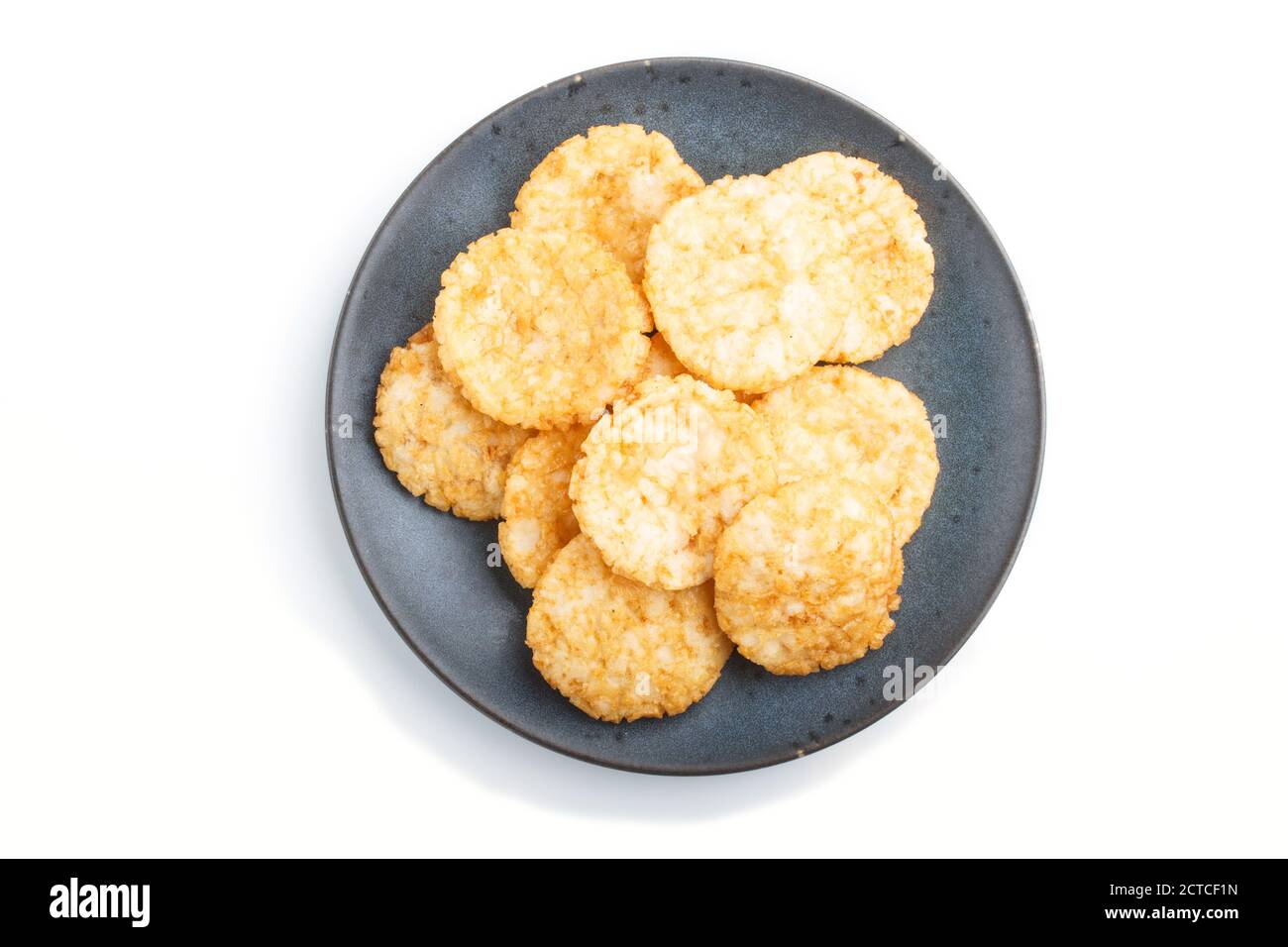 Traditional japanese rice chips cookies with honey and soy sauce on a ...