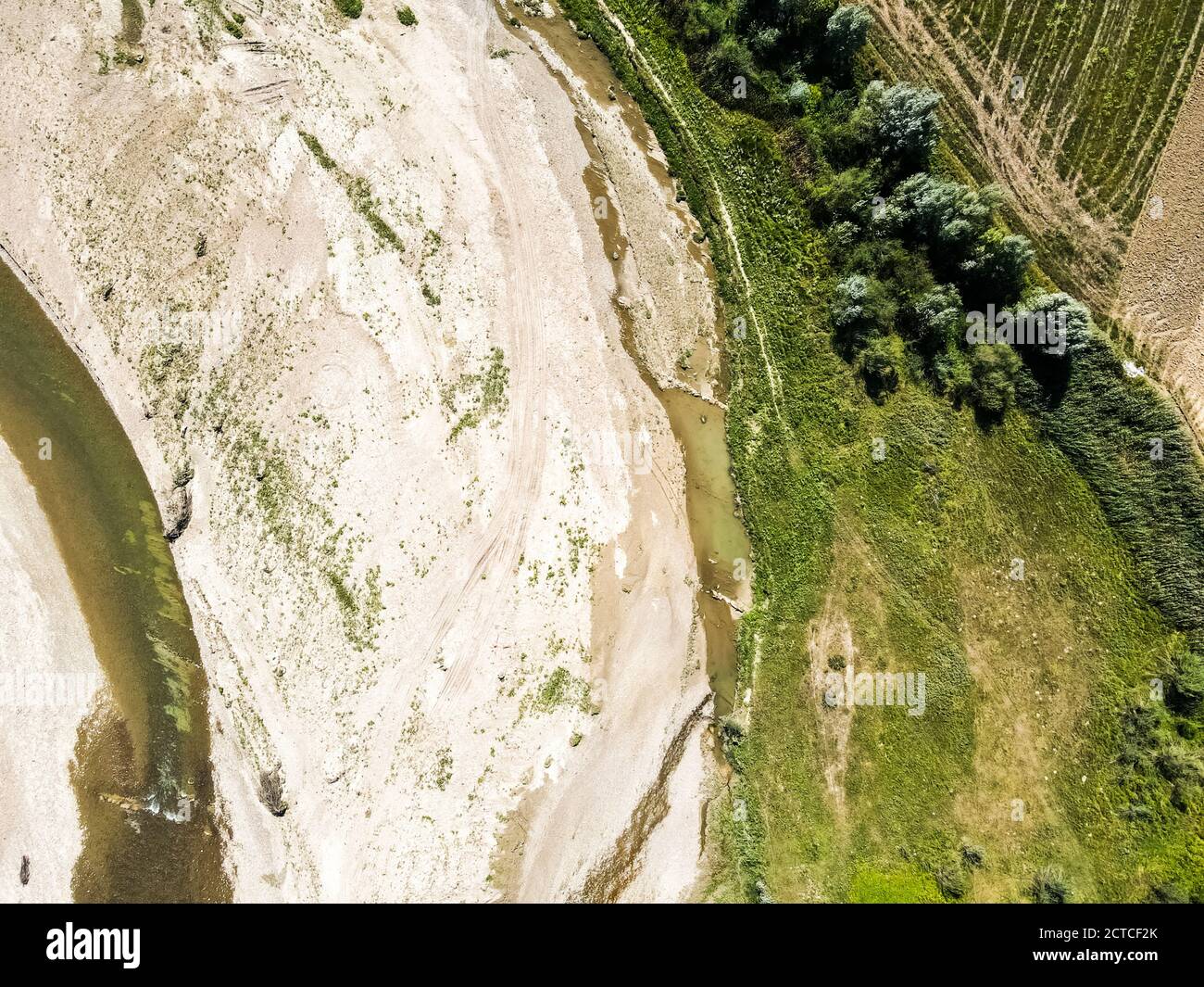Aerial view of rural Romania, with houses, lakes, green forest and ...