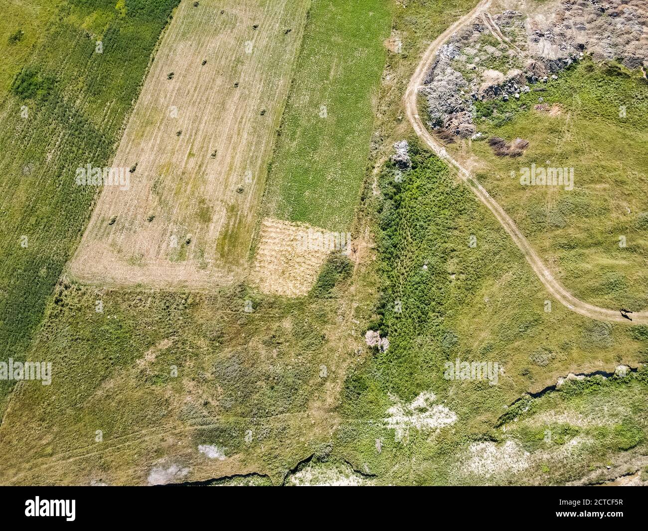Aerial view of rural Romania, with houses, lakes, green forest and ...