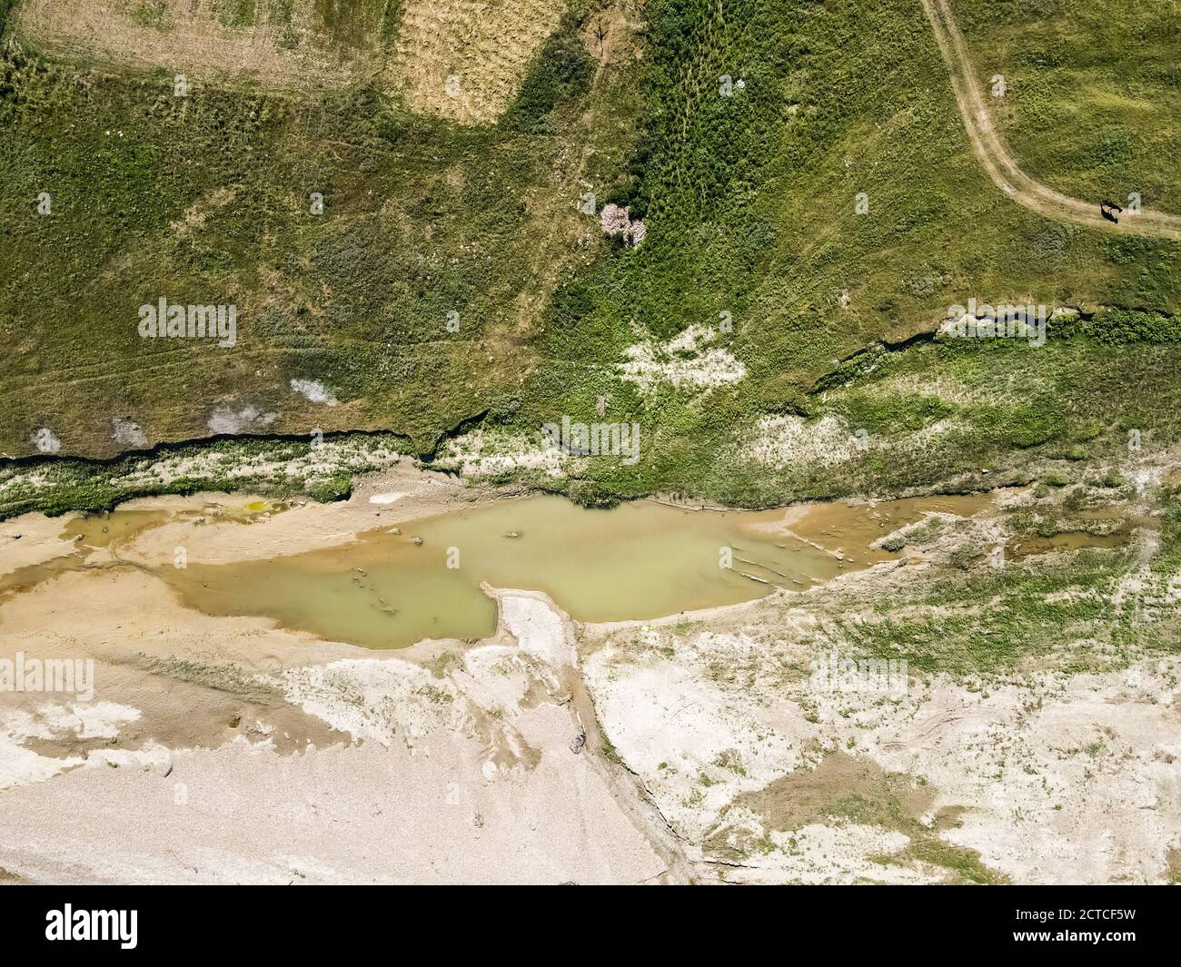 Aerial view of rural Romania, with houses, lakes, green forest and ...