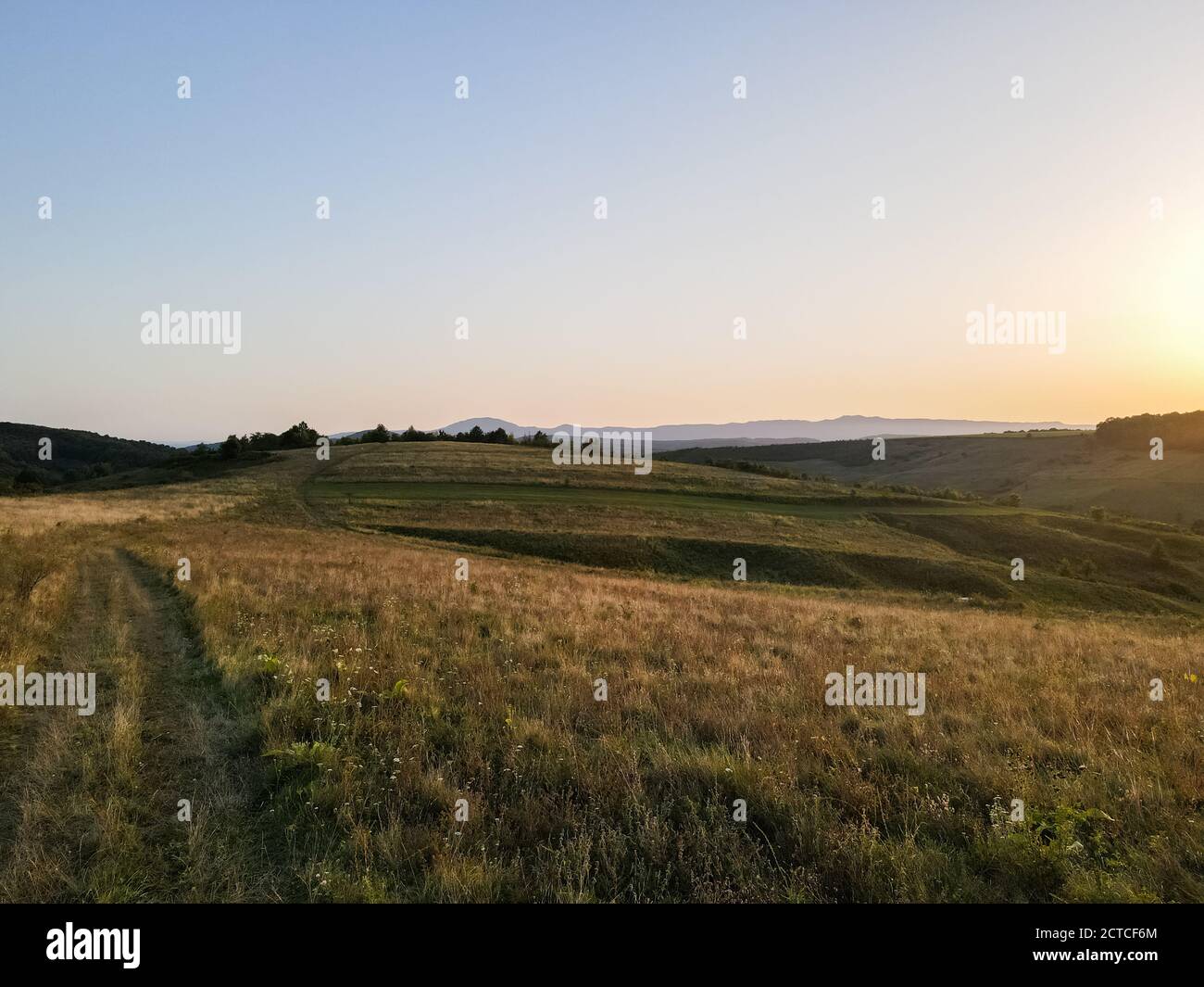 Aerial view of rural Romania, with houses, lakes, green forest and ...