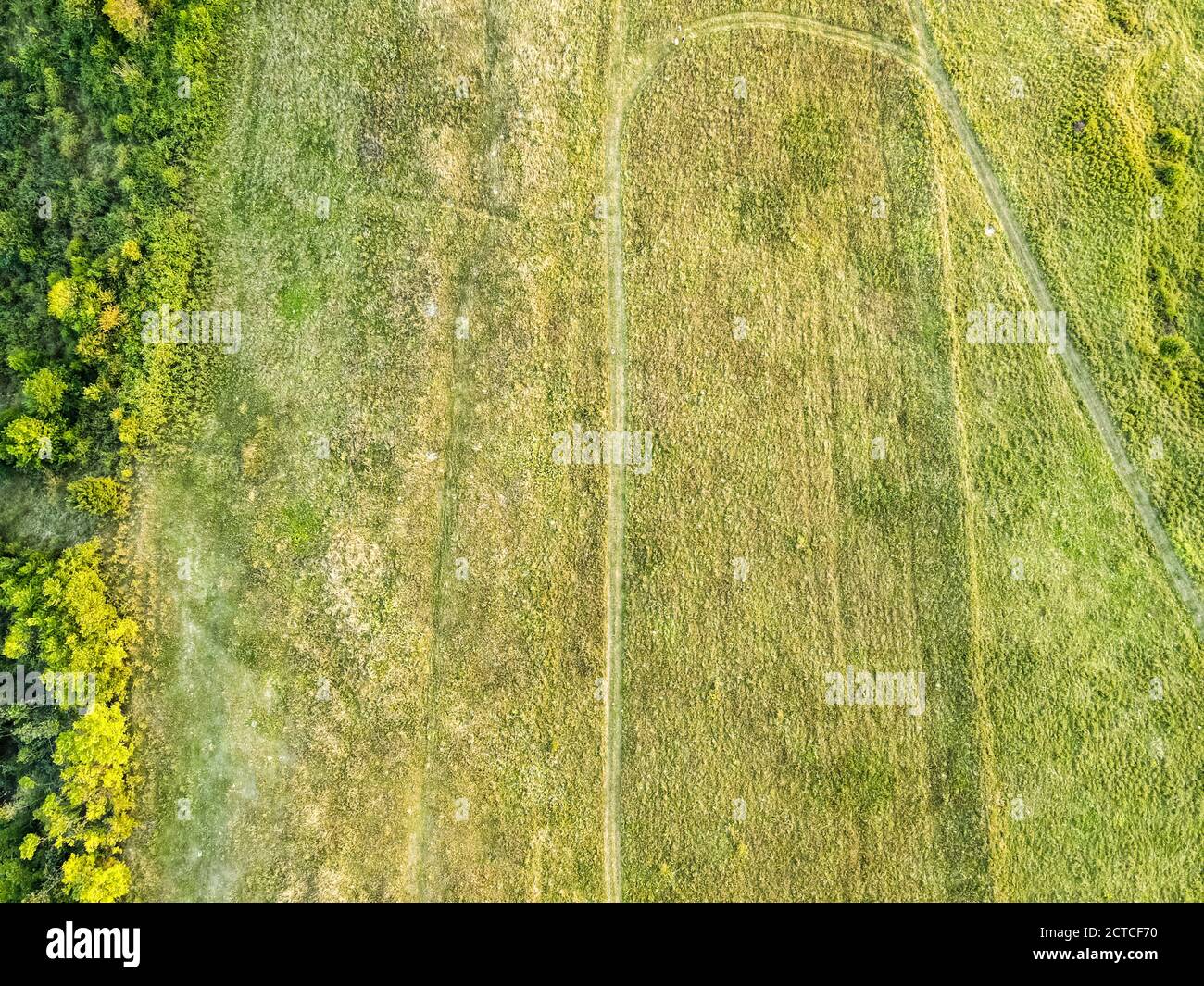 Aerial view of rural Romania, with houses, lakes, green forest and ...