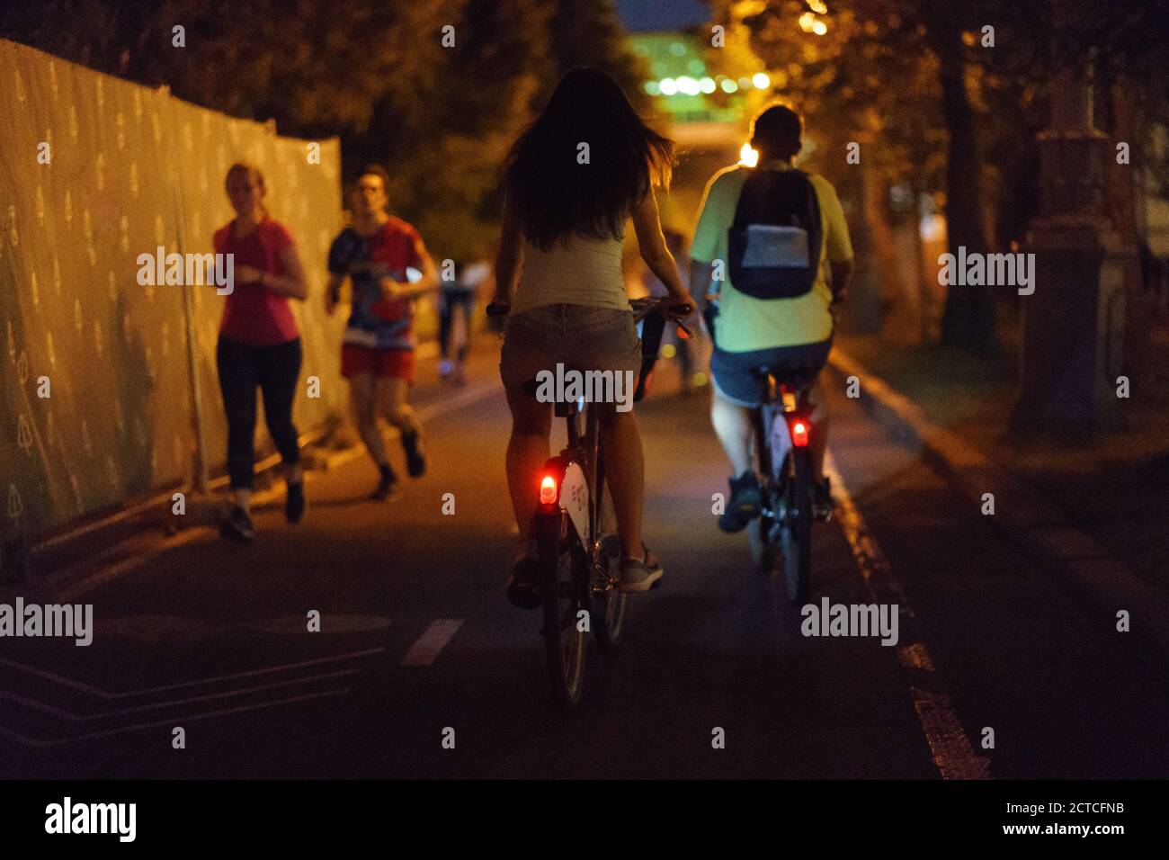 Woman jogging park night hi-res stock photography and images - Alamy