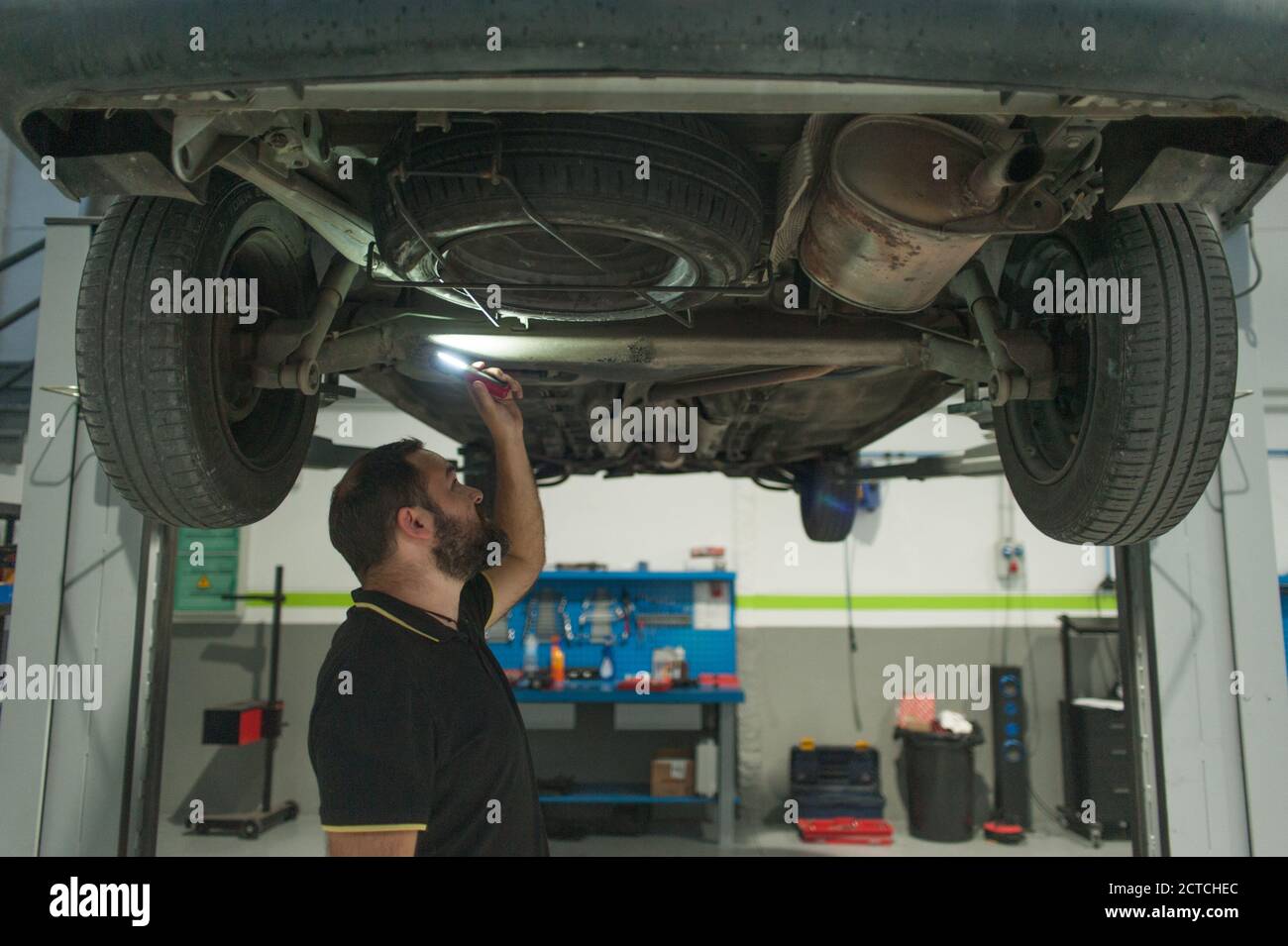 Man working at mechanic workshop Stock Photo - Alamy