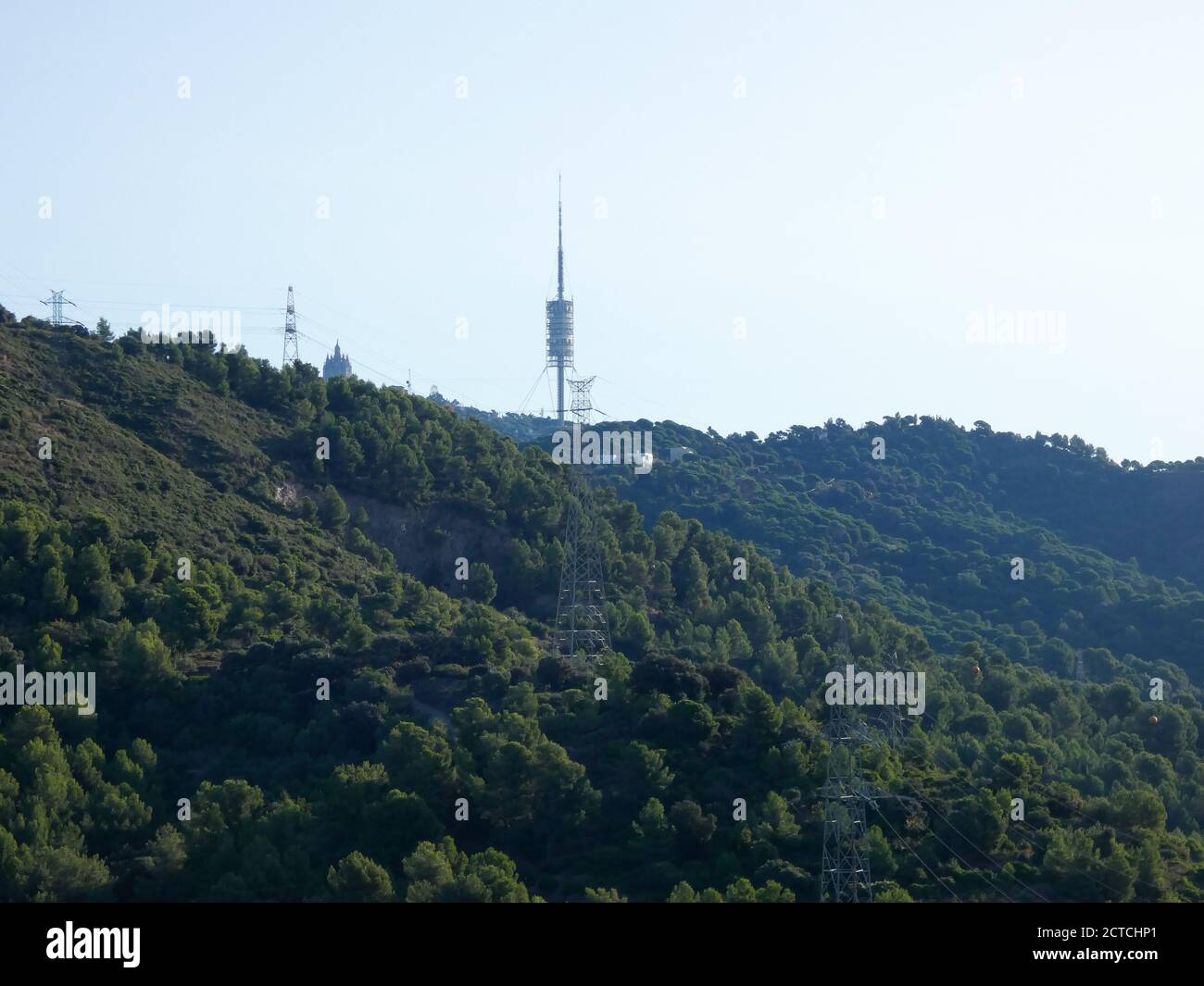 Mountains in backlight with large antennas for professional radio and ...