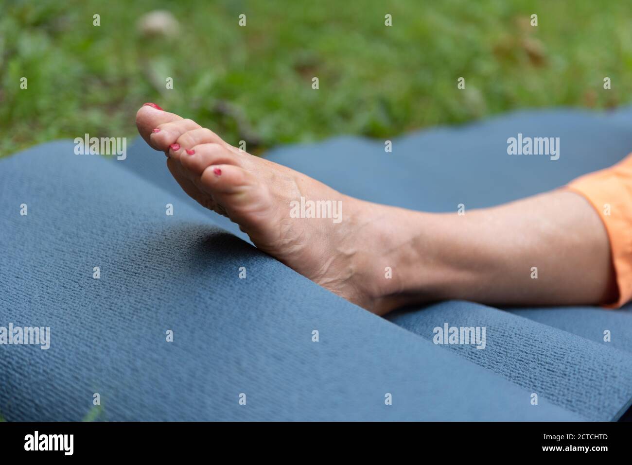 Athletic woman sitting in splits, Monkey yoga pose, asana Hanumanasana ...