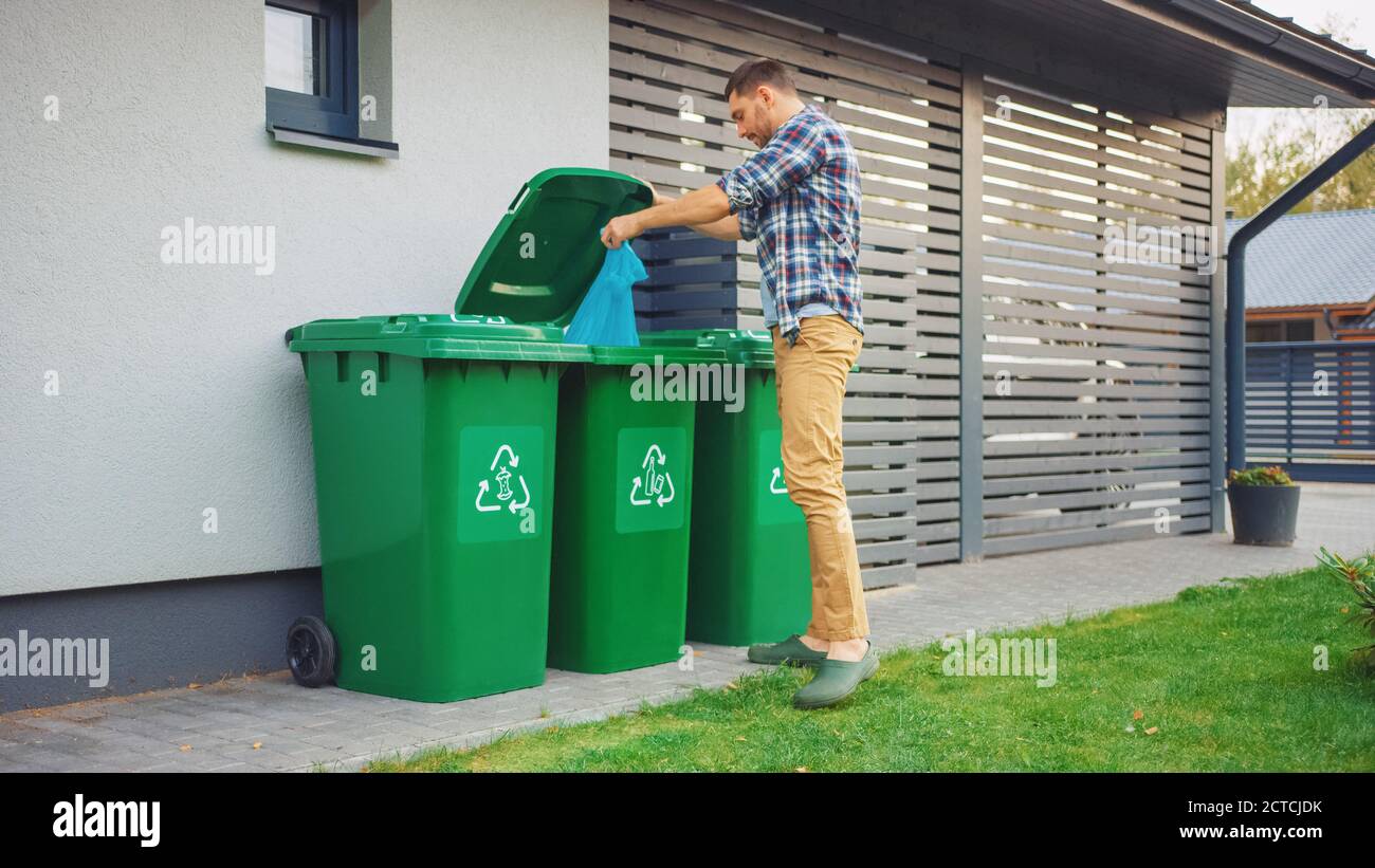 Caucasian Man is Throwing Away Plastic Bags with Sorted Trash. Concept ...