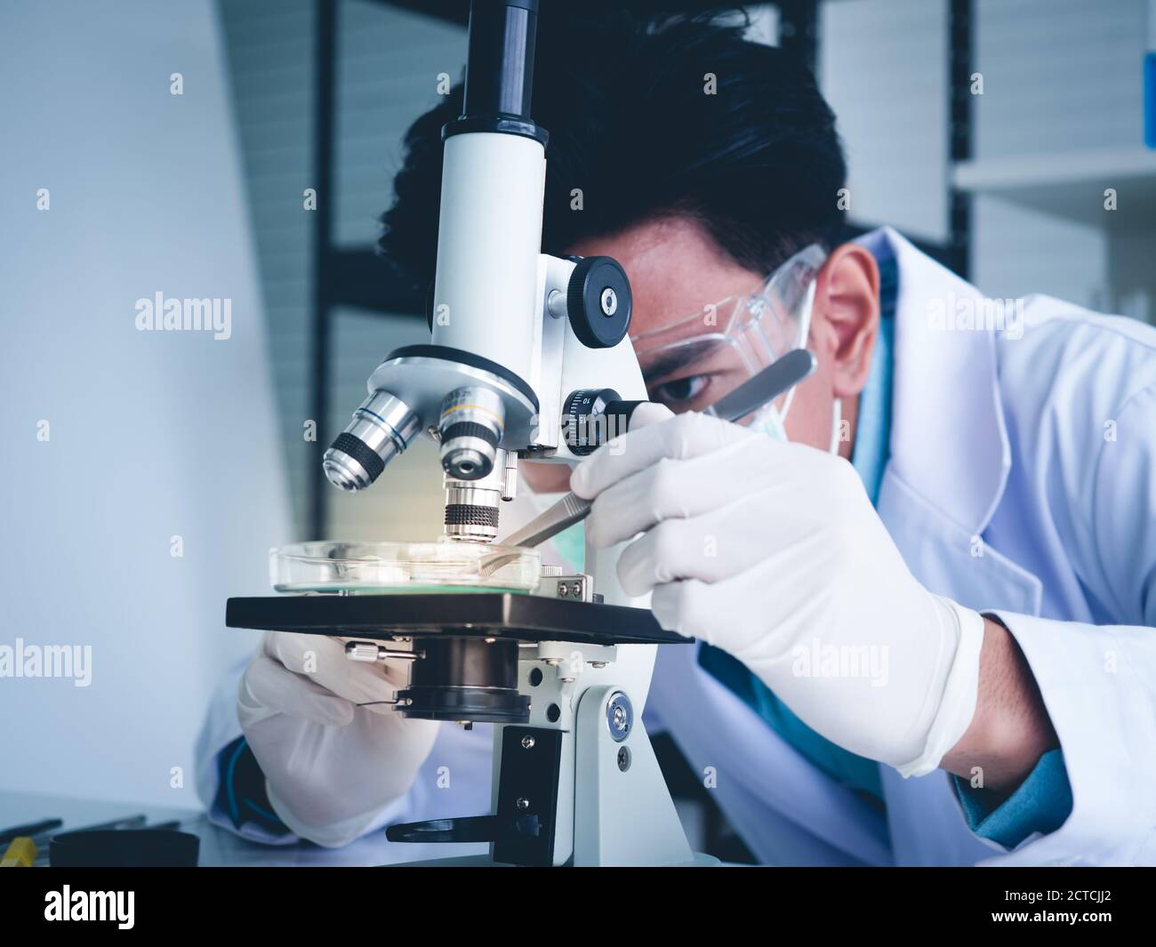 Asian male scientist Is working seriously Chemistry experiment With a ...