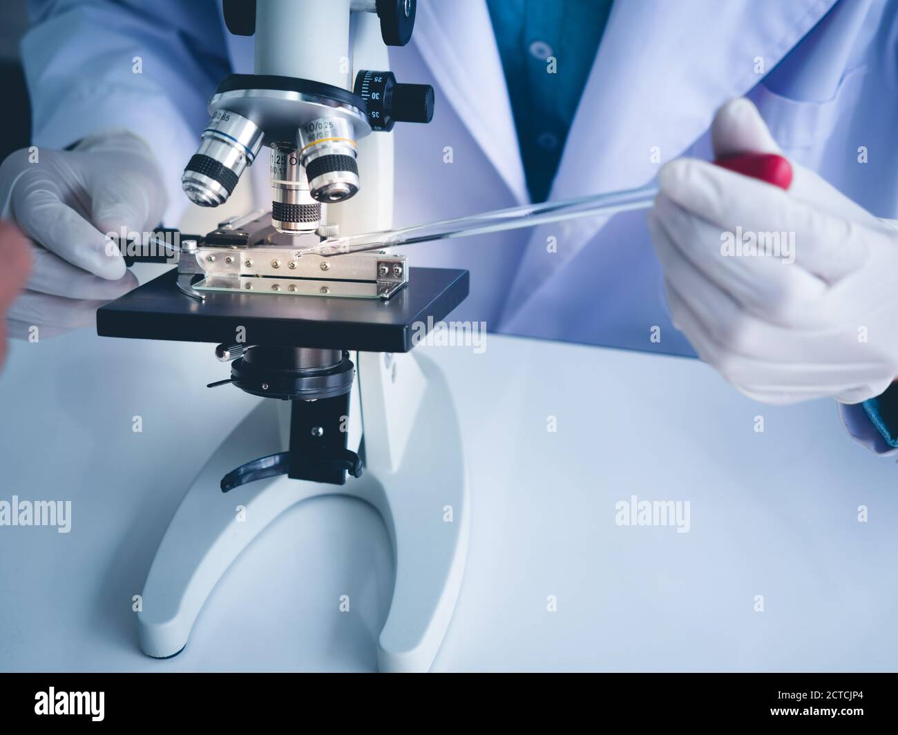 Scientist Is working seriously Chemistry experiment With a microscope ...