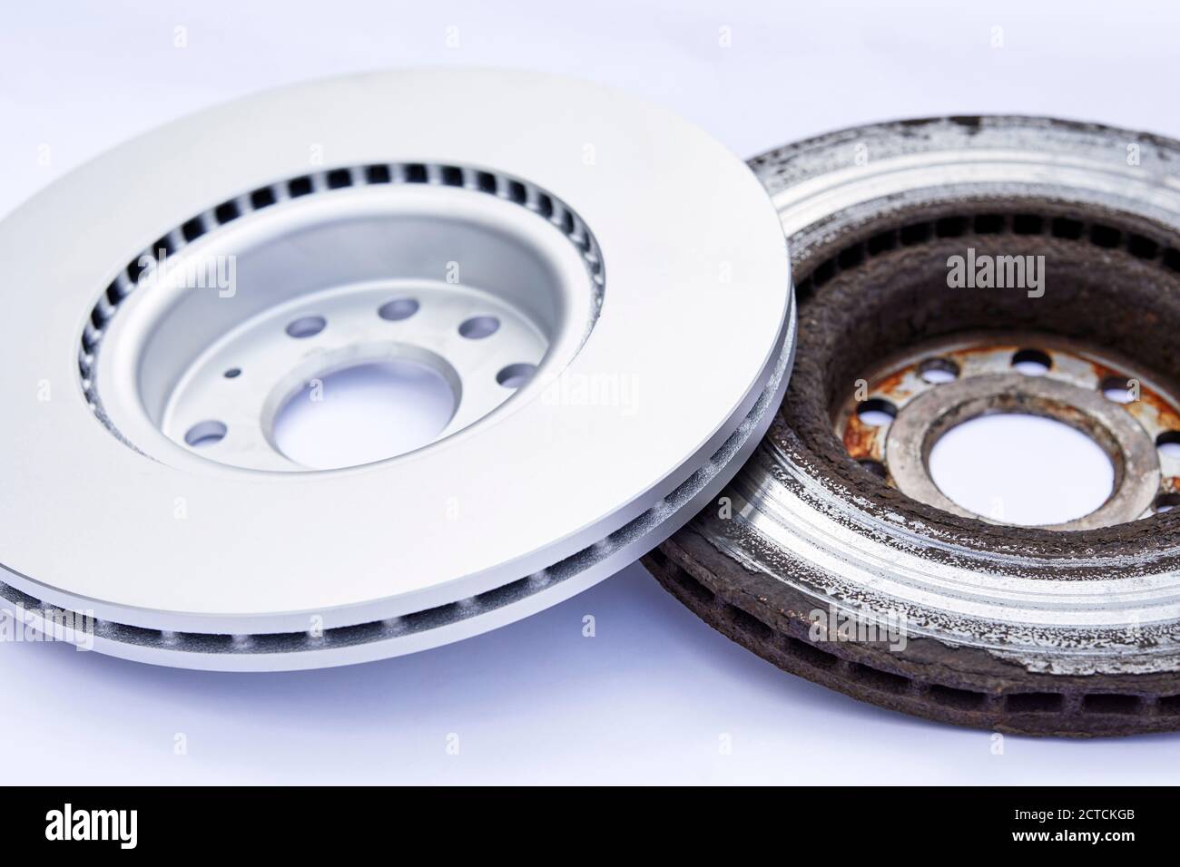 New and old brake discs Stock Photo - Alamy
