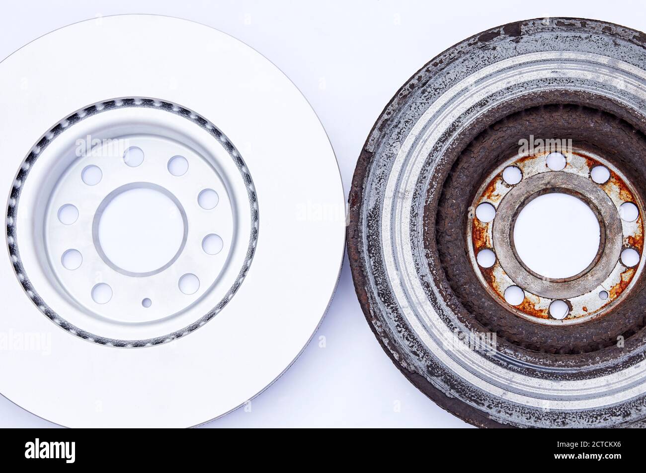 New and old brake discs Stock Photo - Alamy