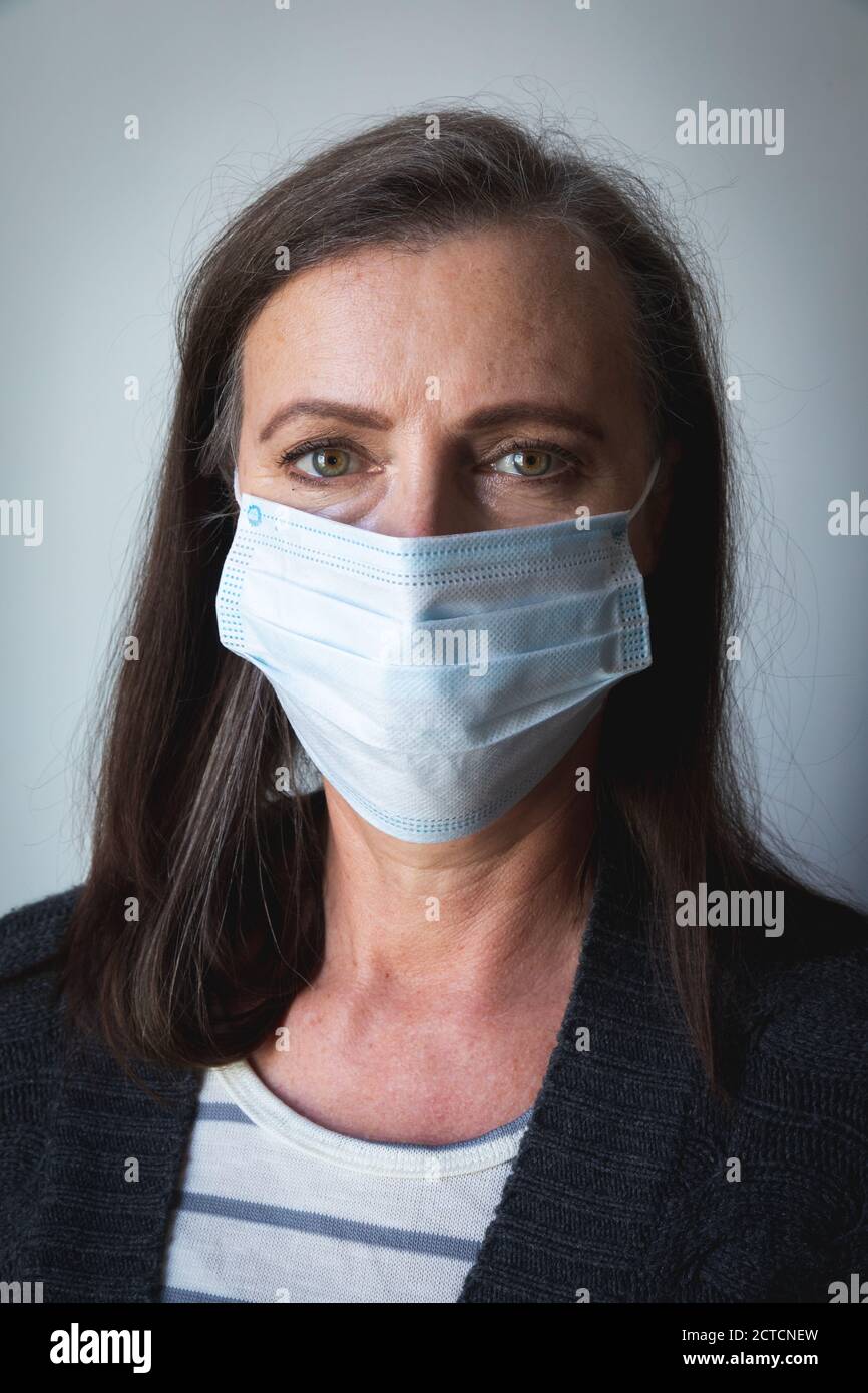 Woman facemask home hi-res stock photography and images - Alamy