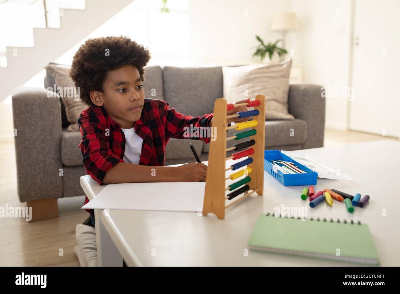 Kid using crayons hi-res stock photography and images - Alamy
