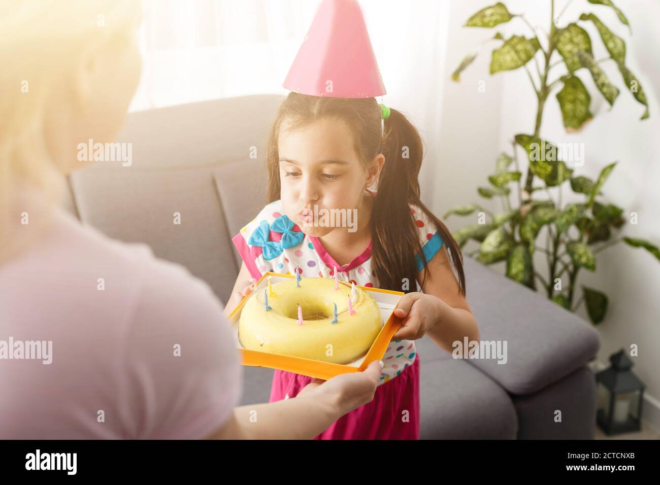 Happy girl sibling celebrating birthday via internet in quarantine time ...