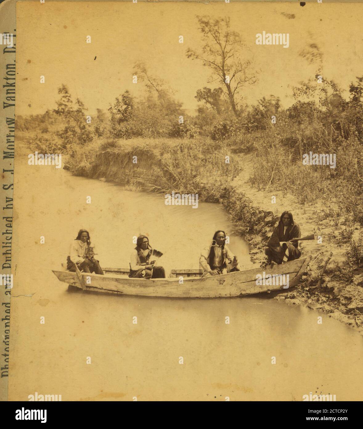 Four Indian men in a boat on Ponca creek., Morrow, Stanley J., North ...