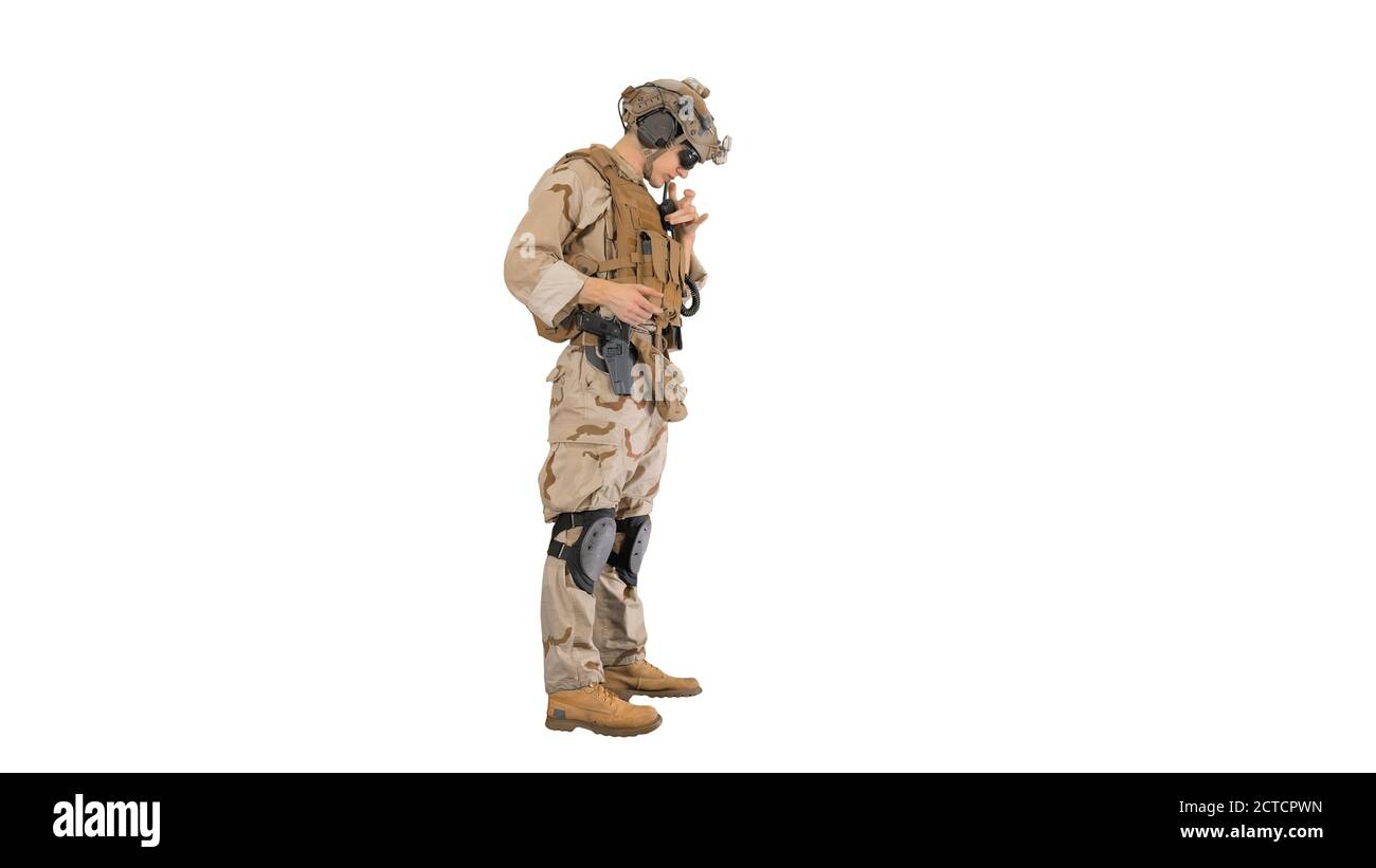 Soldier standing and talking on the radio on white background Stock ...