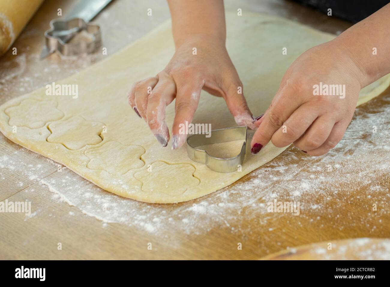 Mother cooking festive homemade sweets. Family weekend activities Stock ...