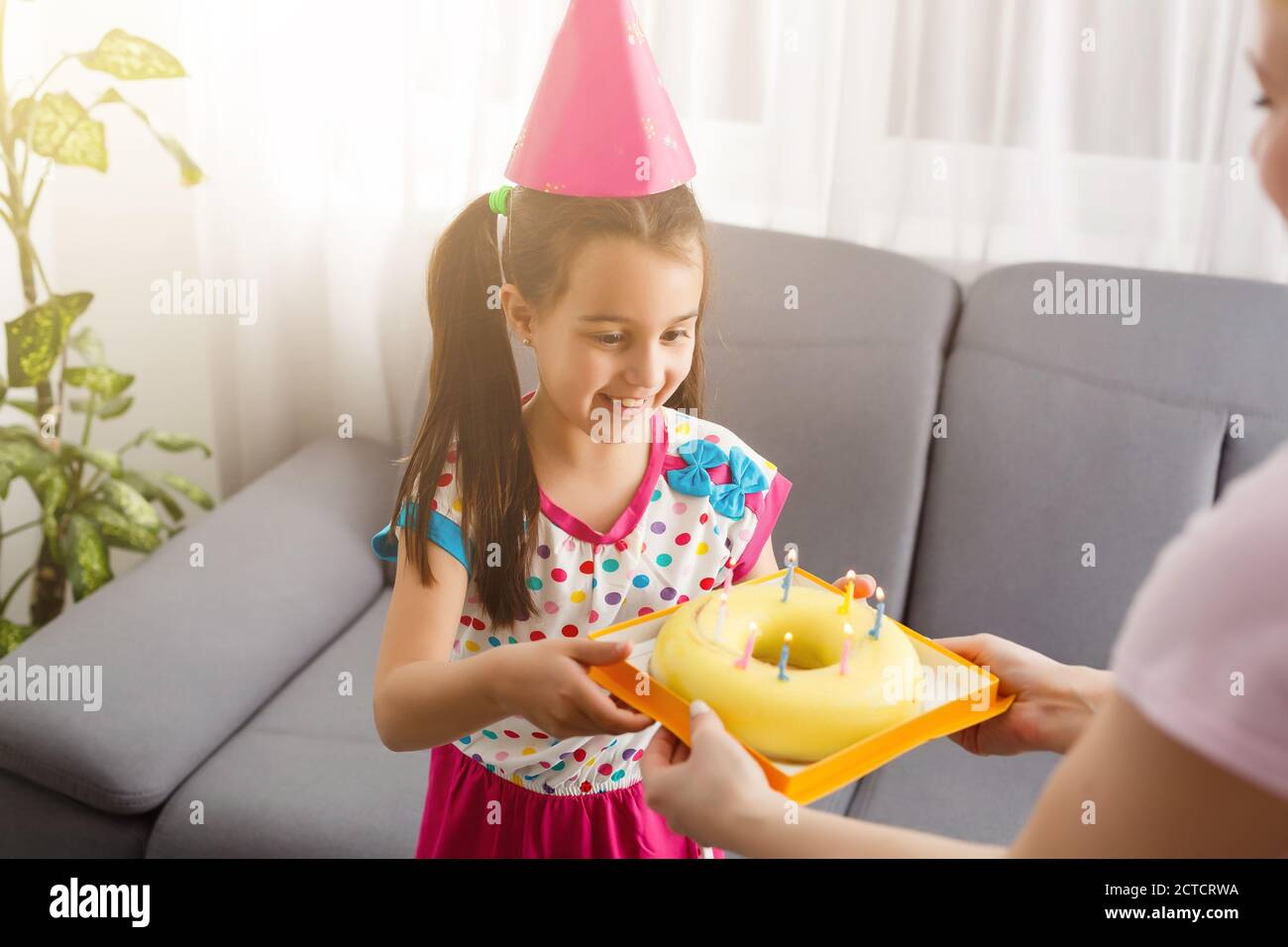 Happy girl sibling celebrating birthday via internet in quarantine time ...