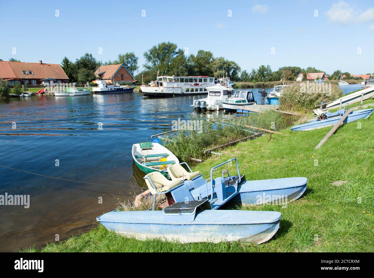 The ferry ship passing along Minija River in Minge village, the only ...