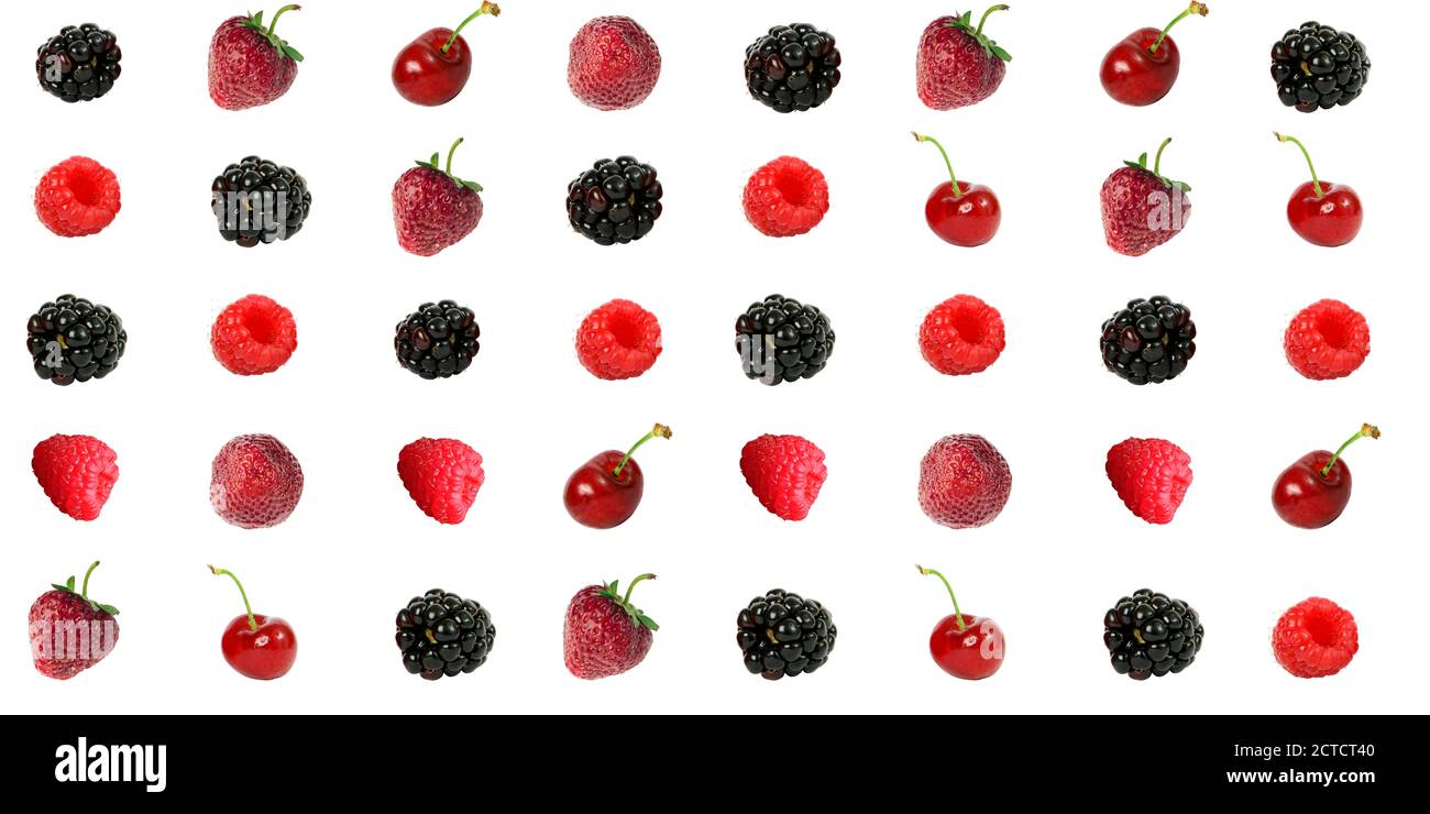 Assortment of ripe berries, lined up in rows, on a white background in ...