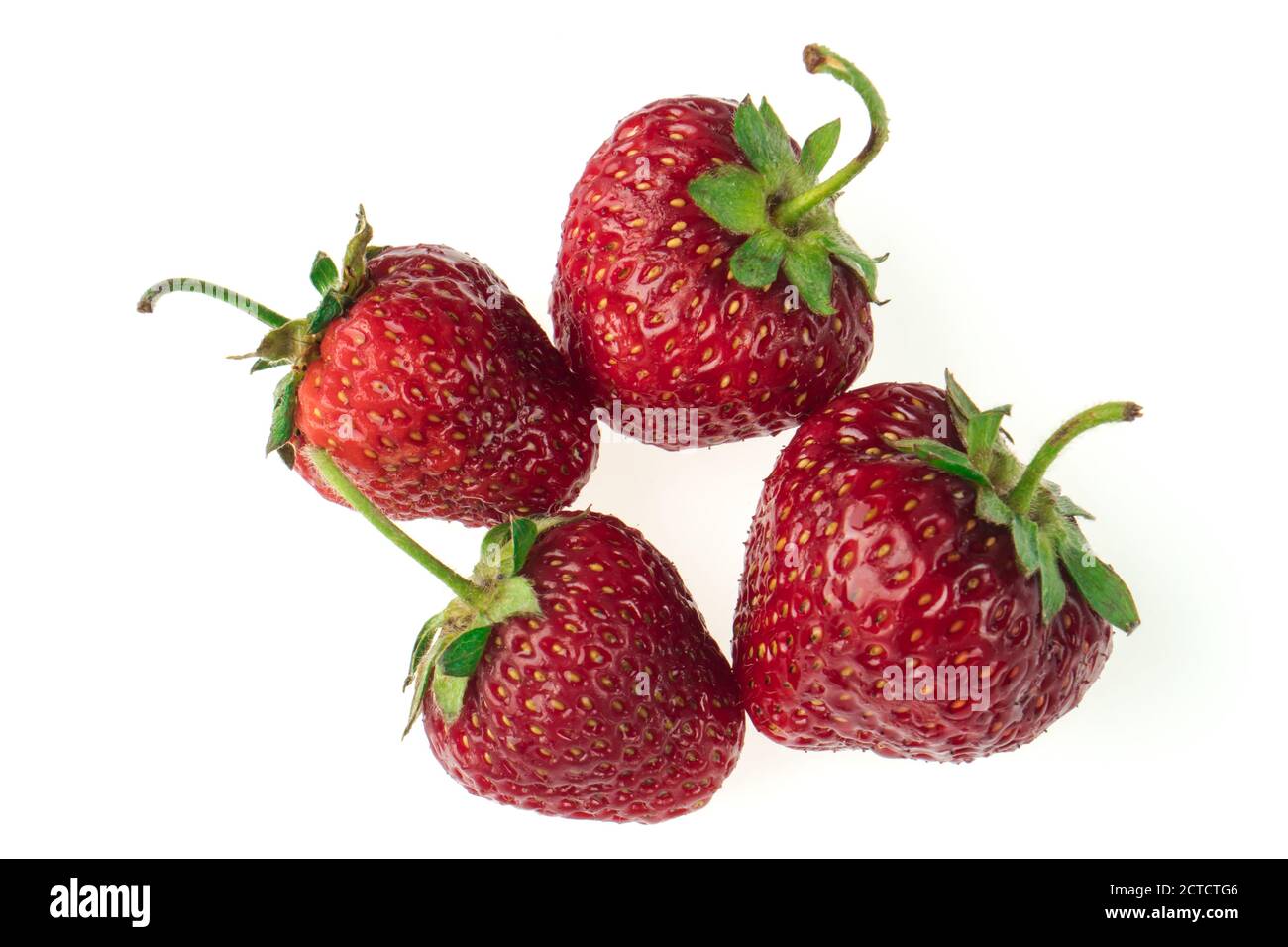 A bunch of tasty juicy red strawberries in the amount of four pieces on ...
