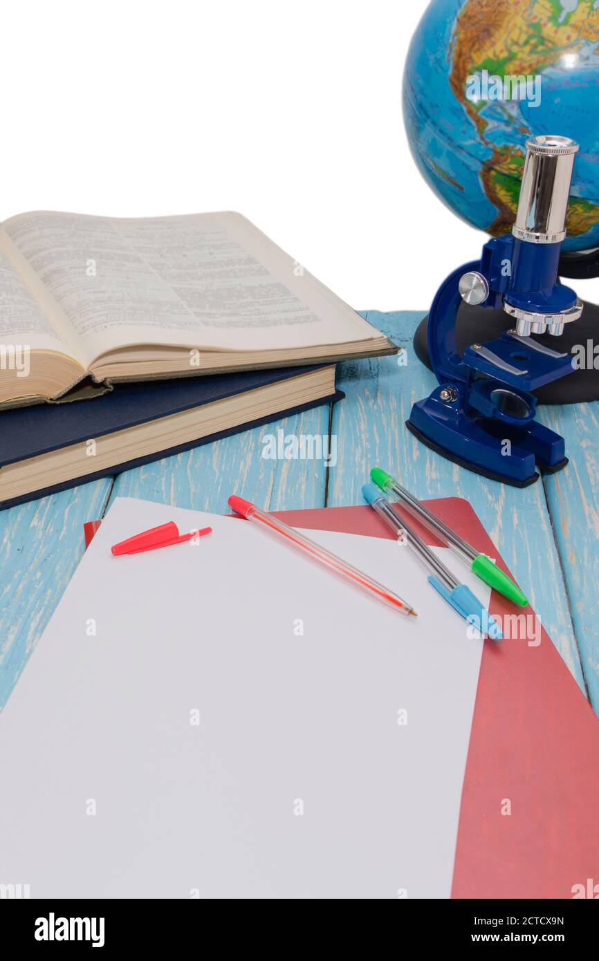 Microscope, books and others tools for education Stock Photo - Alamy