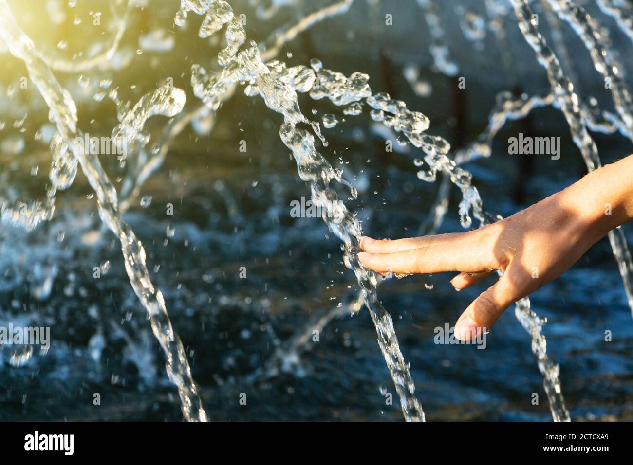 Child water hand hi-res stock photography and images - Alamy