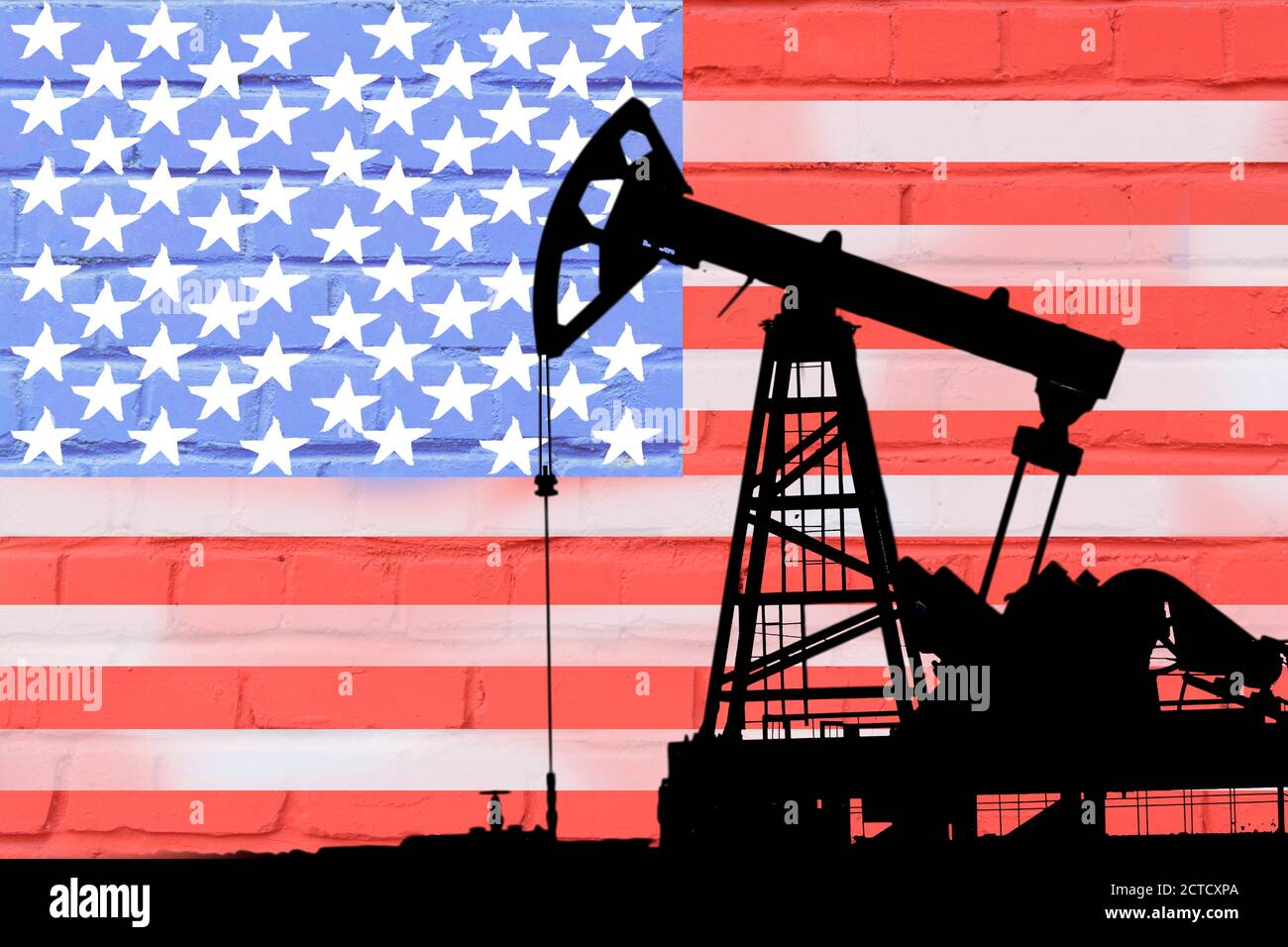 silhouette of oil drilling pump on background of united states flag ...