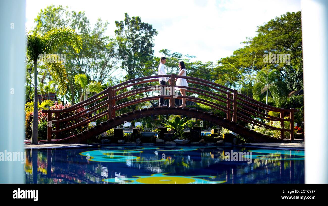 couple in a bridge happy young family Stock Photo - Alamy