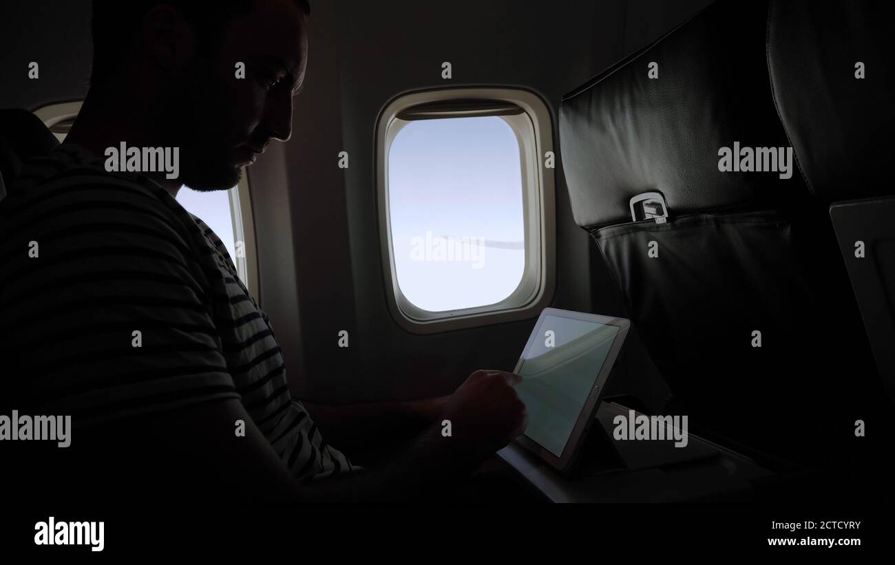 Man mature plane passenger hi-res stock photography and images - Alamy