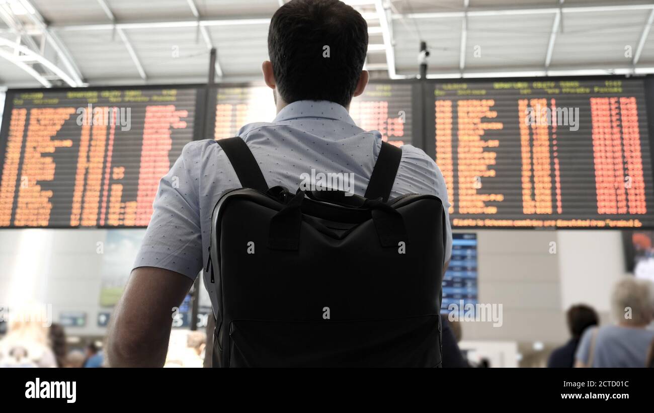 Female traveler checking flight information hi-res stock photography ...