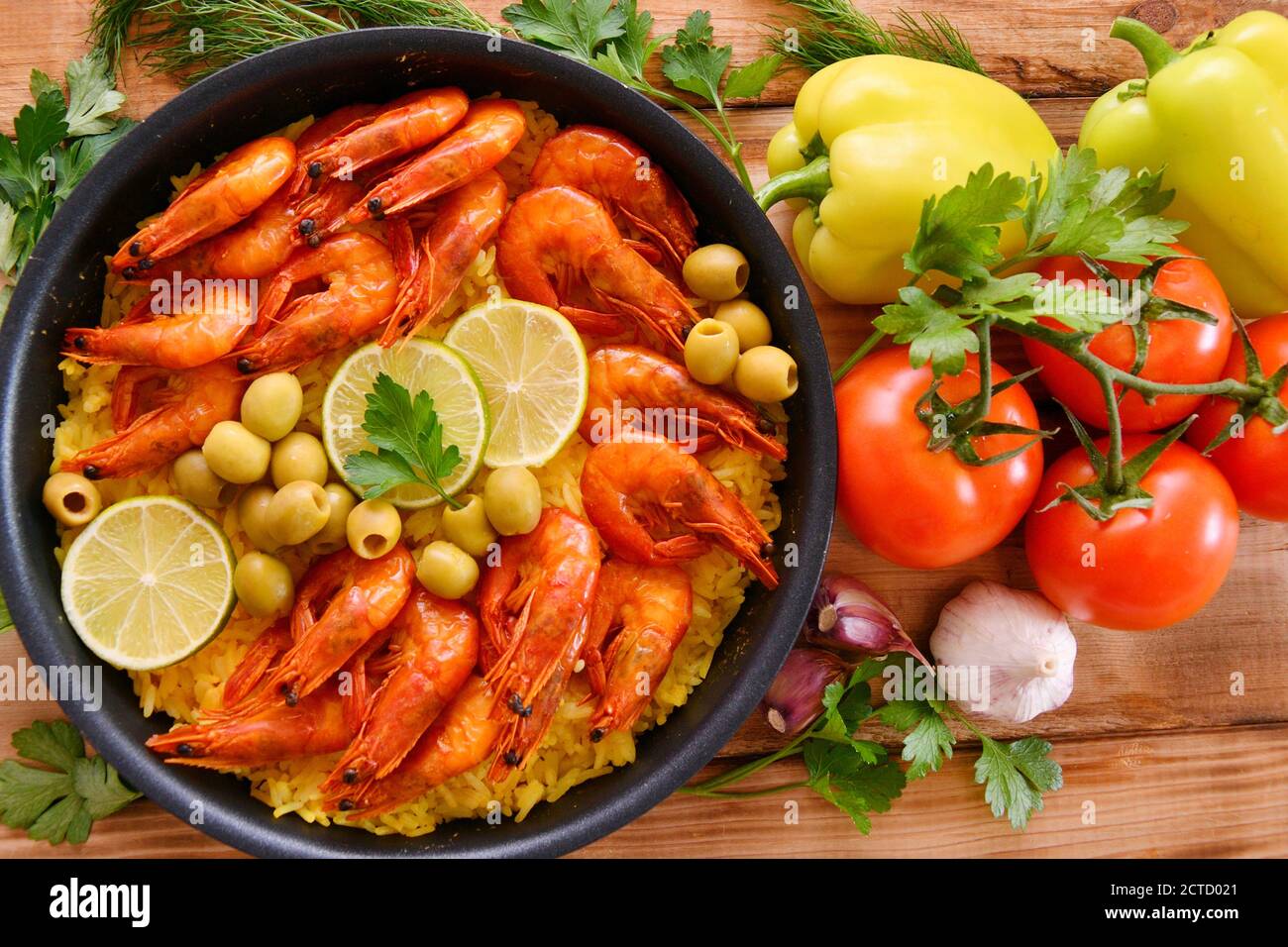 Rice paella with shrimp, saffron and olive oil - Spanish national dish ...