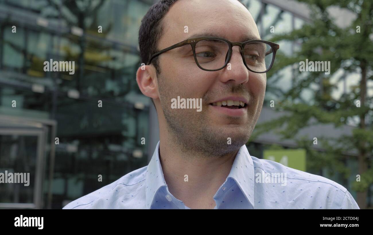 Guy telling a story to someone out of frame Stock Photo - Alamy