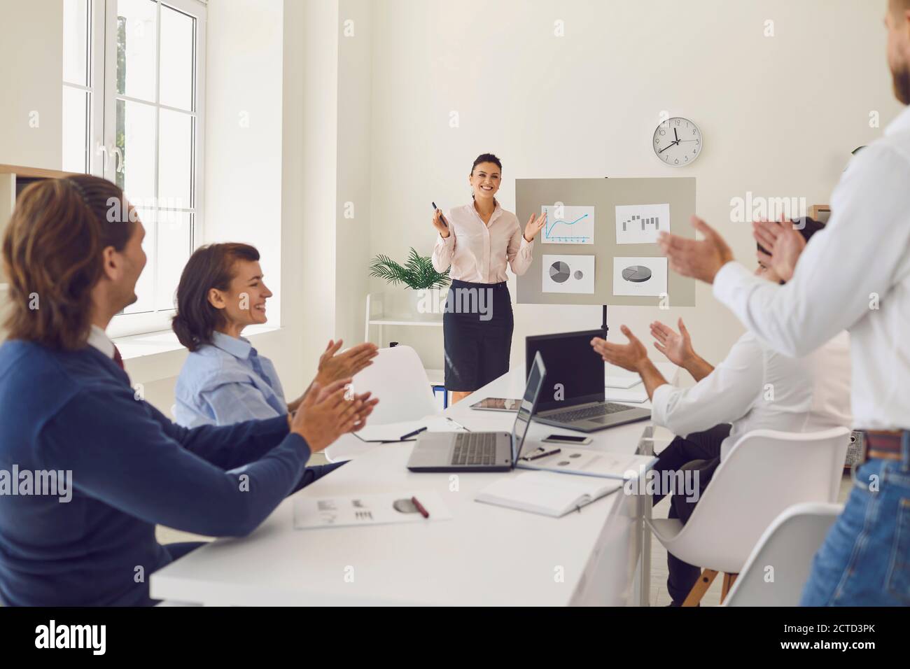 Happy employees positive manager celebrating hi-res stock photography ...