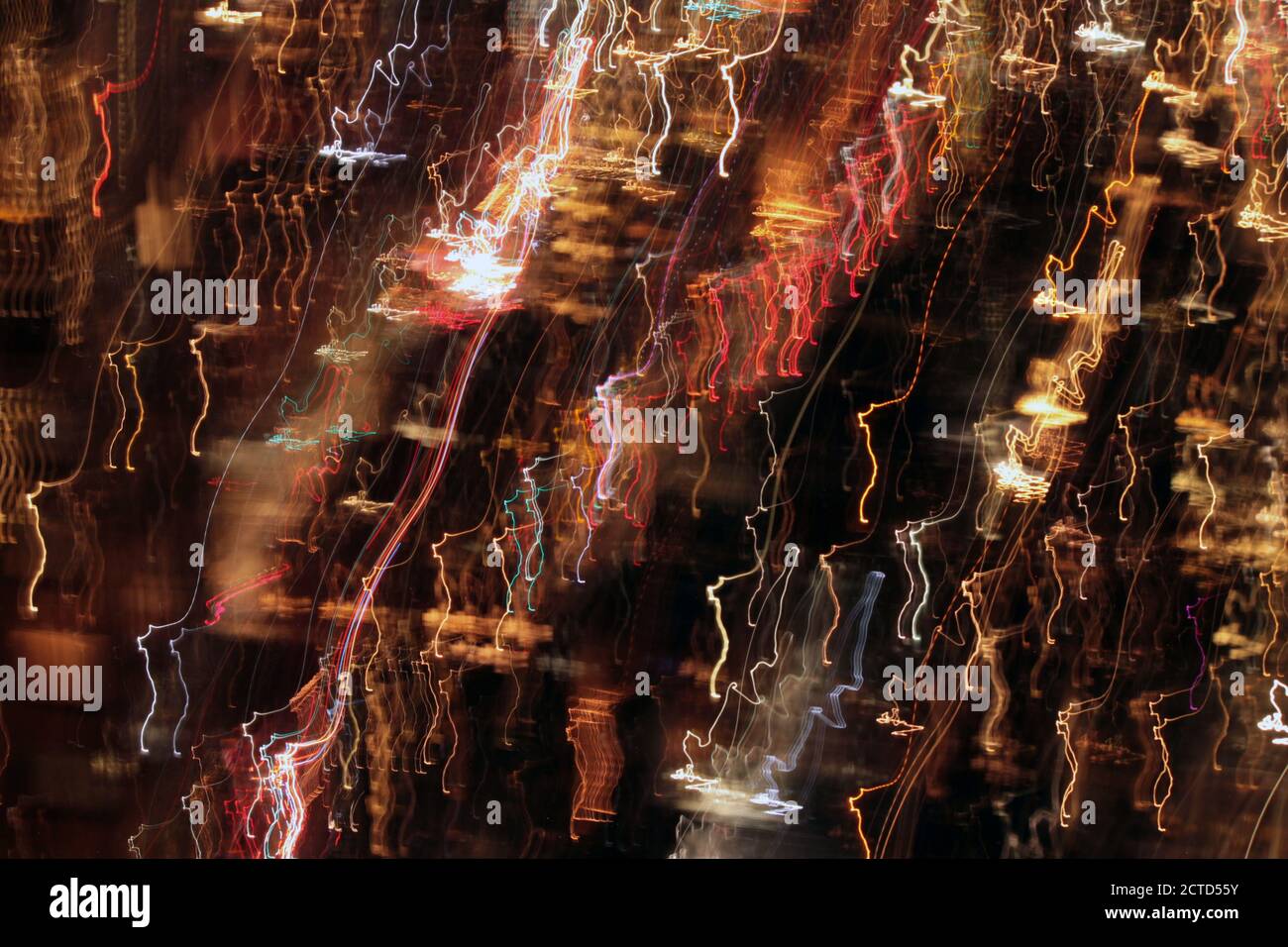 The colored moving lights in the dark night Stock Photo - Alamy