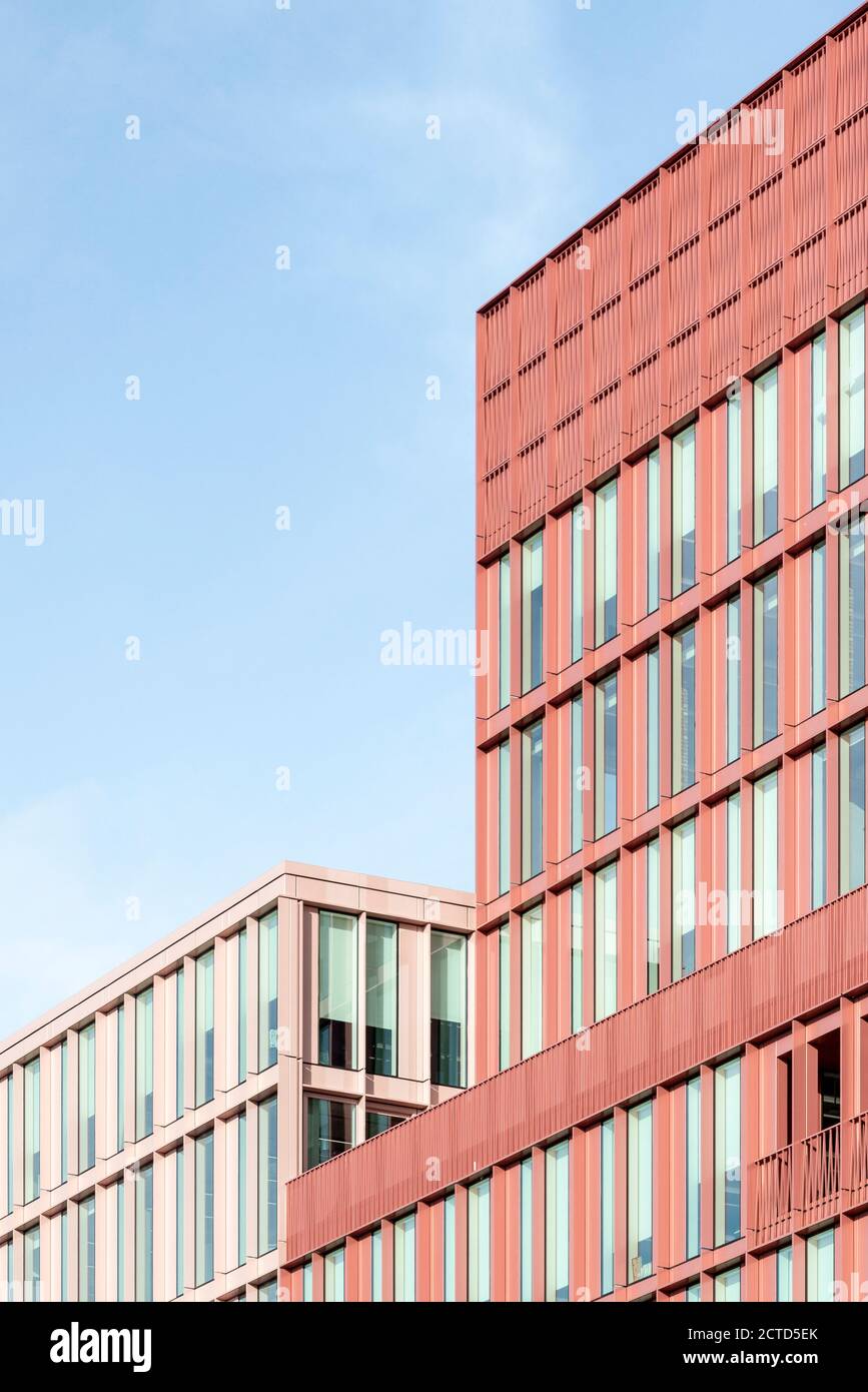 R7 by Morris+Company, a civic office building with a pale pink finned ...