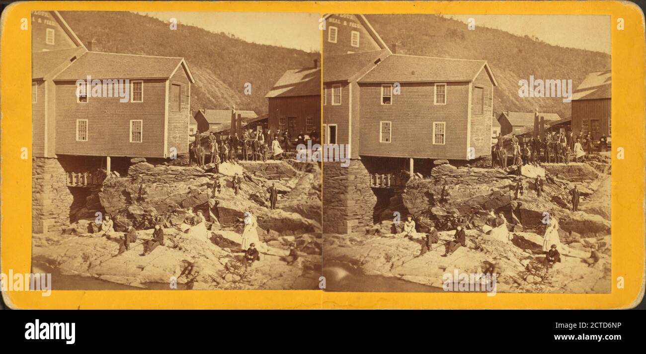 People on rocks near river and buildings damaged by flood., still image ...