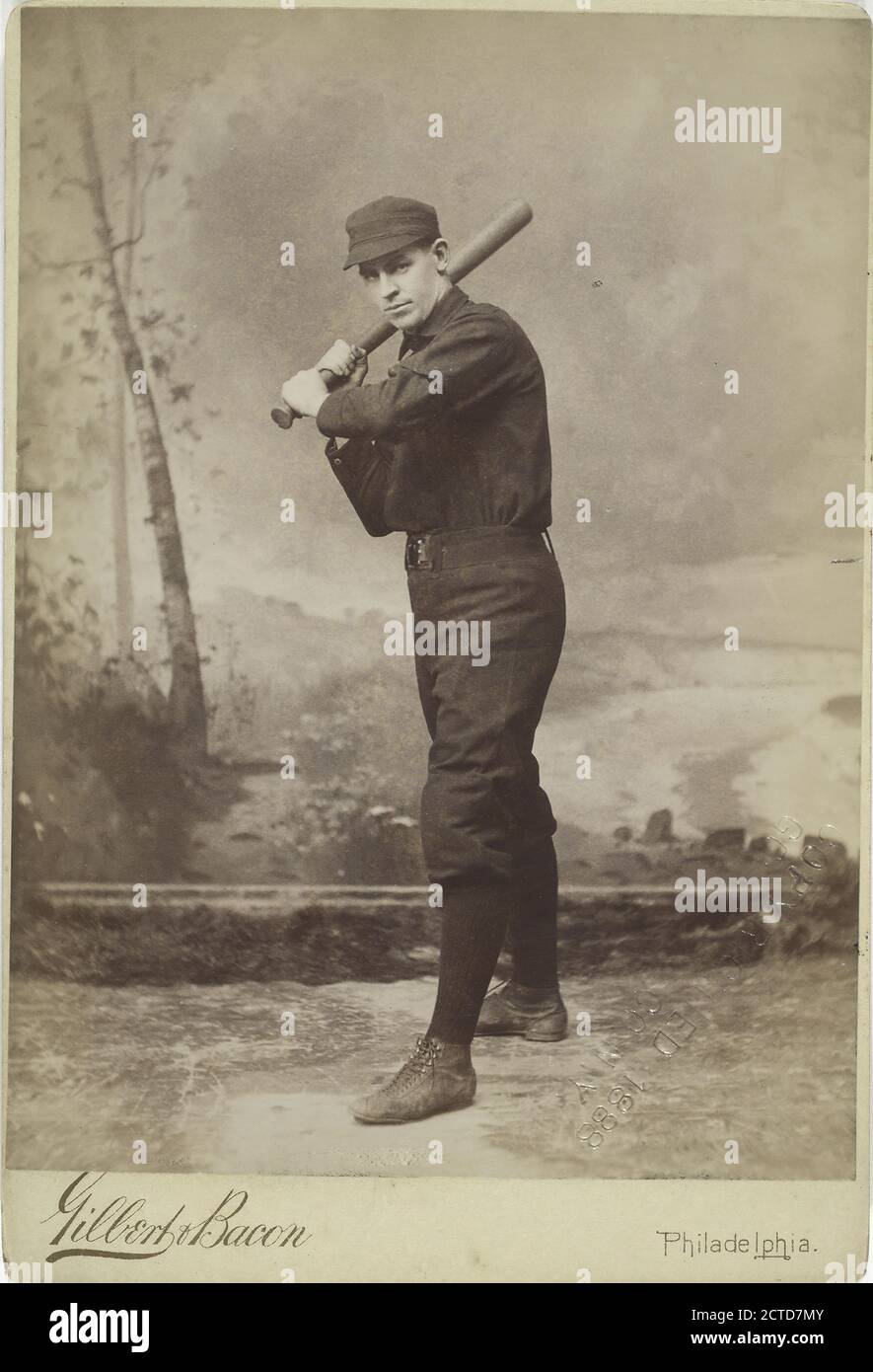 Unidentified baseball player in dark uniform - batting form, still ...