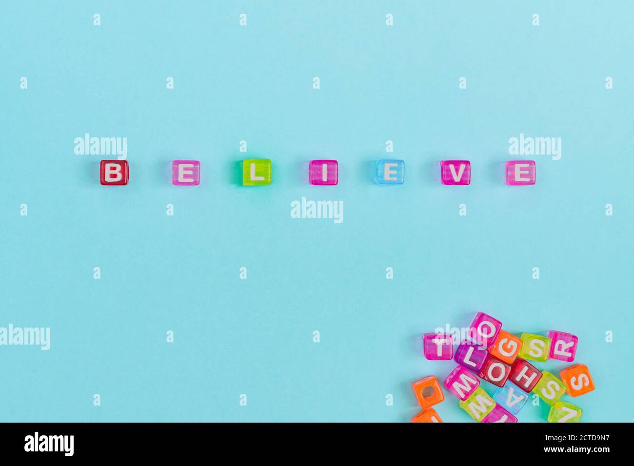believe inscription made of colorful cube beads with letters. Festive ...